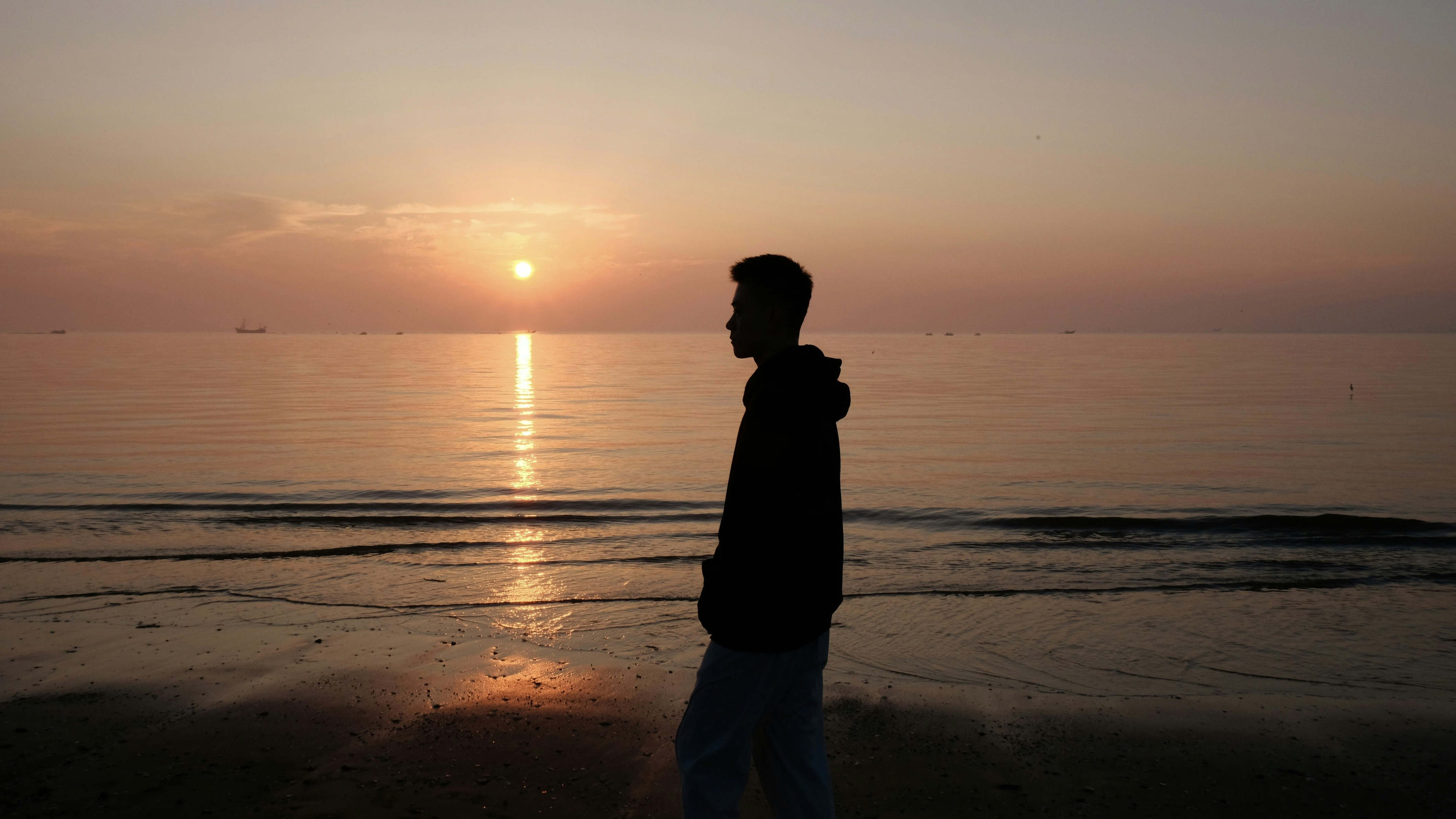 Sunlit silhouette at the tide’s edge