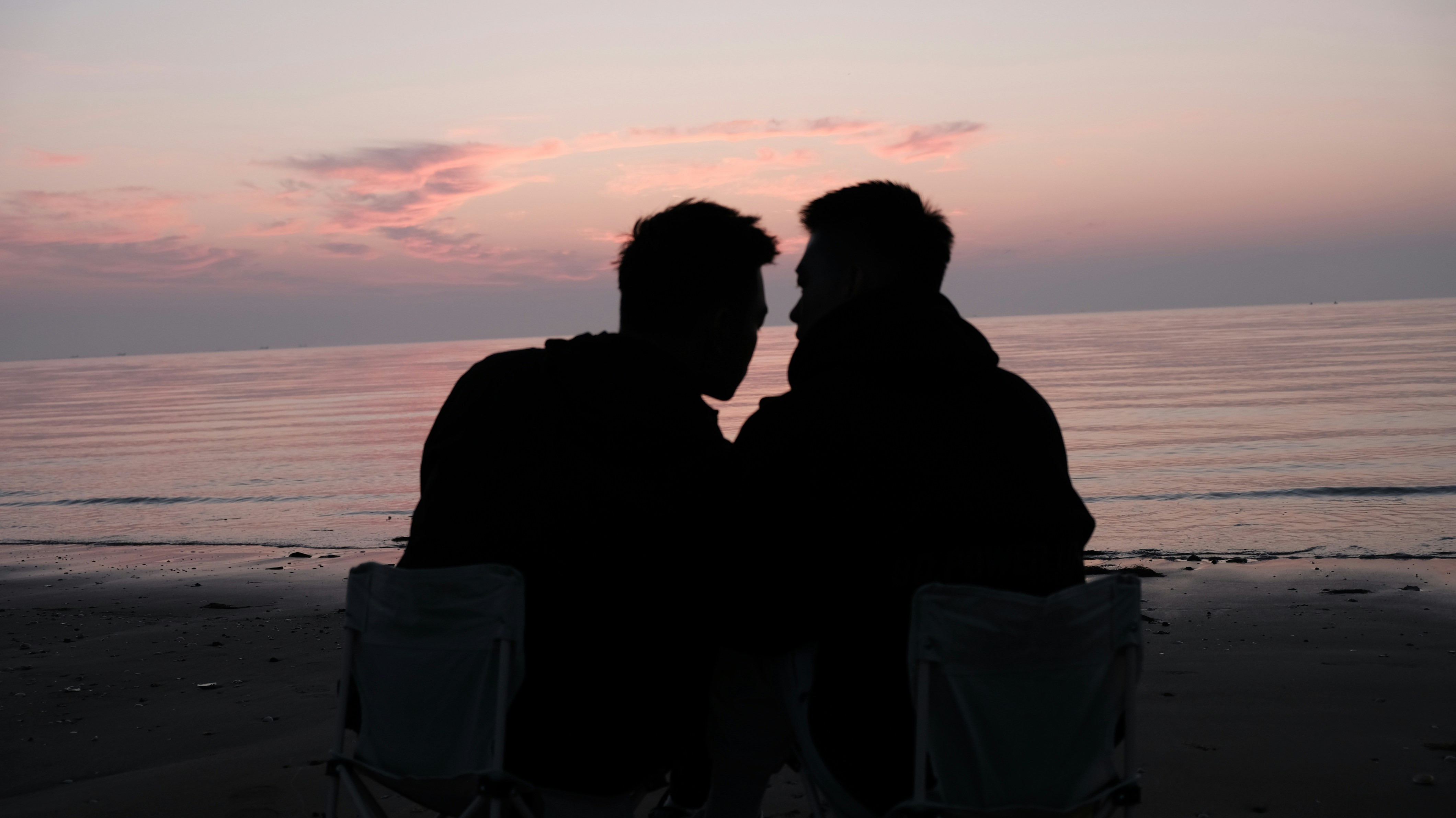 Silhouettes in Dialogue at Sunset