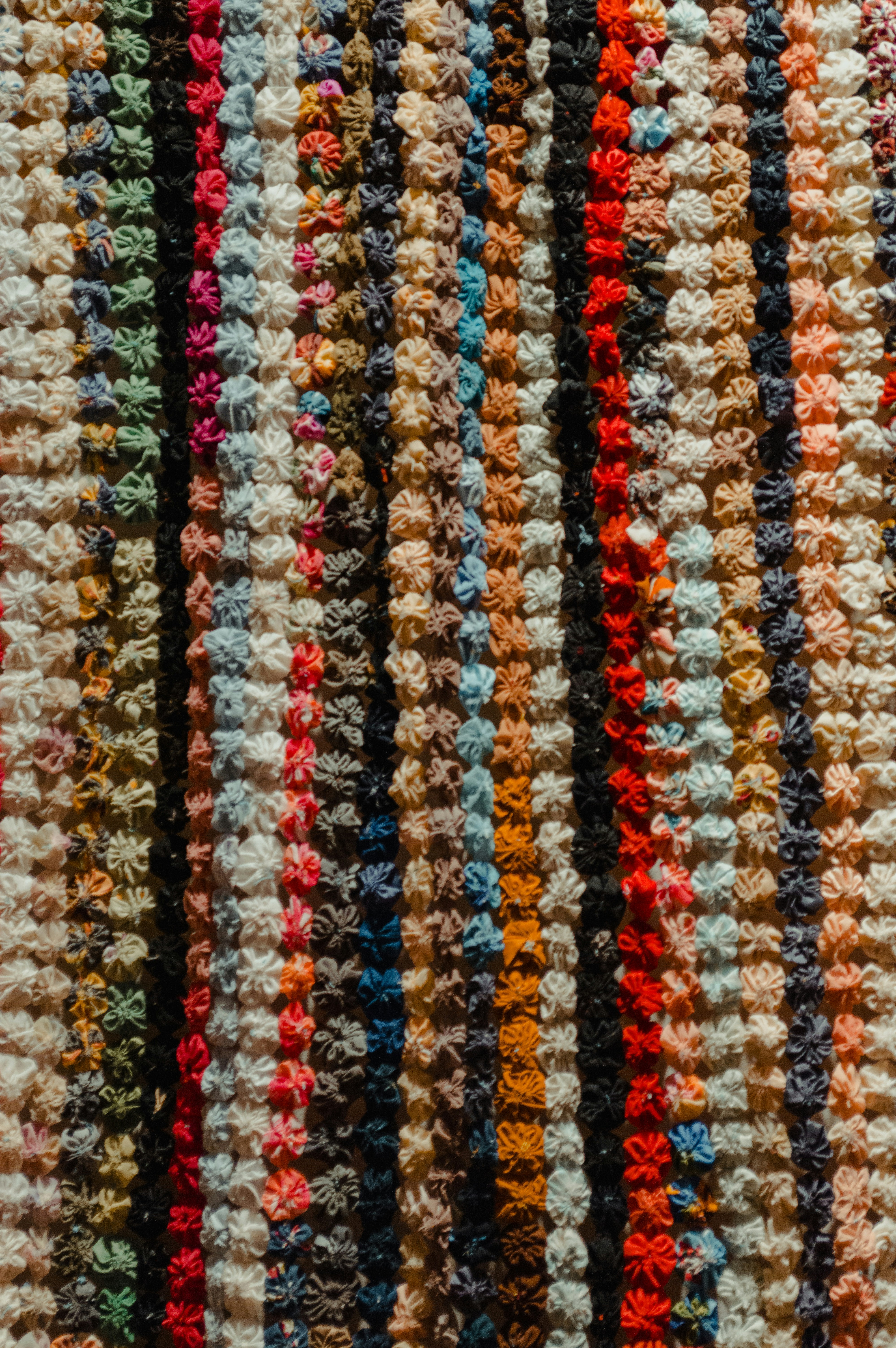 Vibrant Threads: A Tapestry of Colorful Buds in Vertical Strands