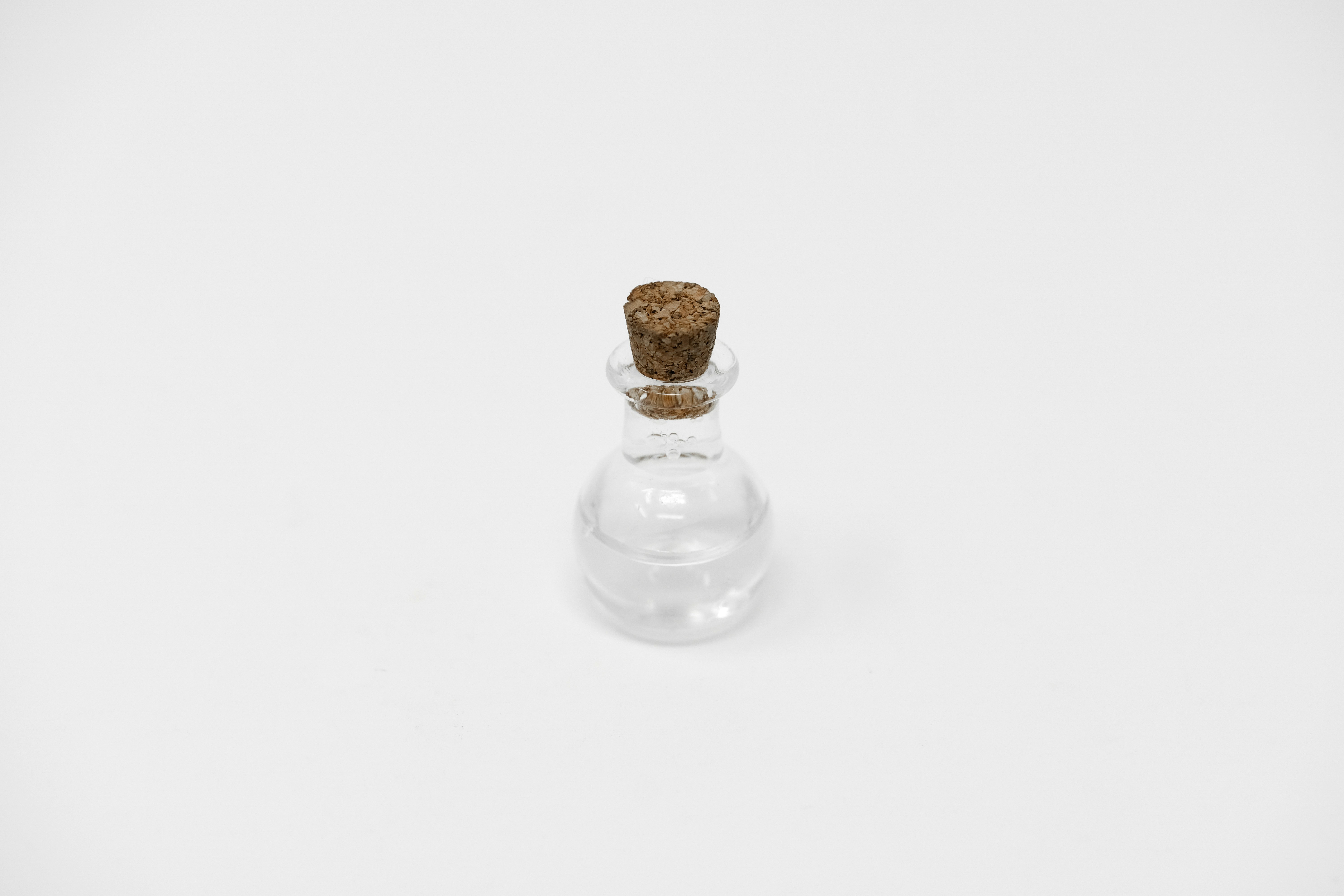 Tiny Glass Bottle with Cork: Minimalist Still-Life Moment