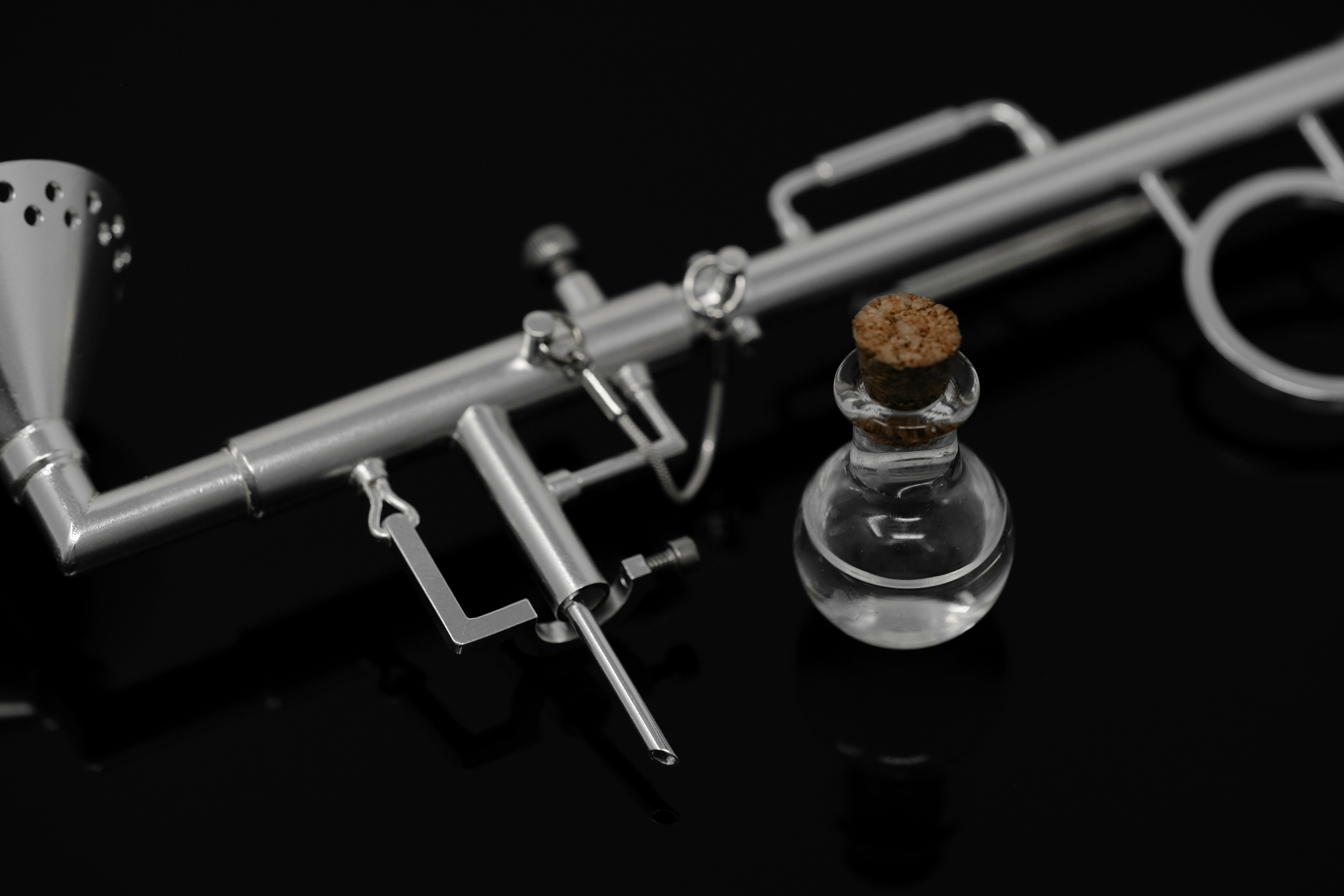 Silent Precision: A Silver Lab Instrument and Corked Beaker