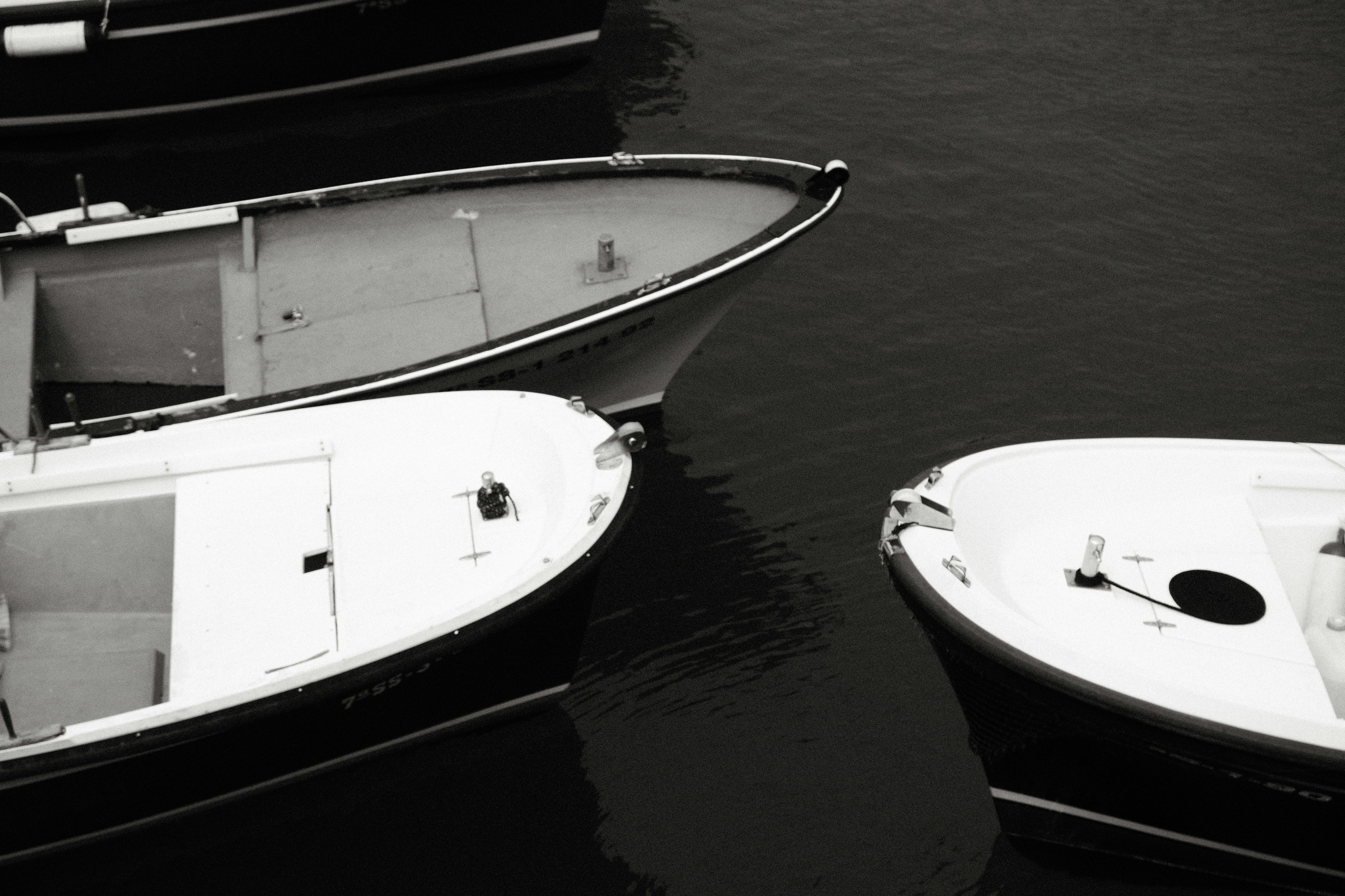 Quiet Confluence: Boats Nestle in a Monochrome Pocket