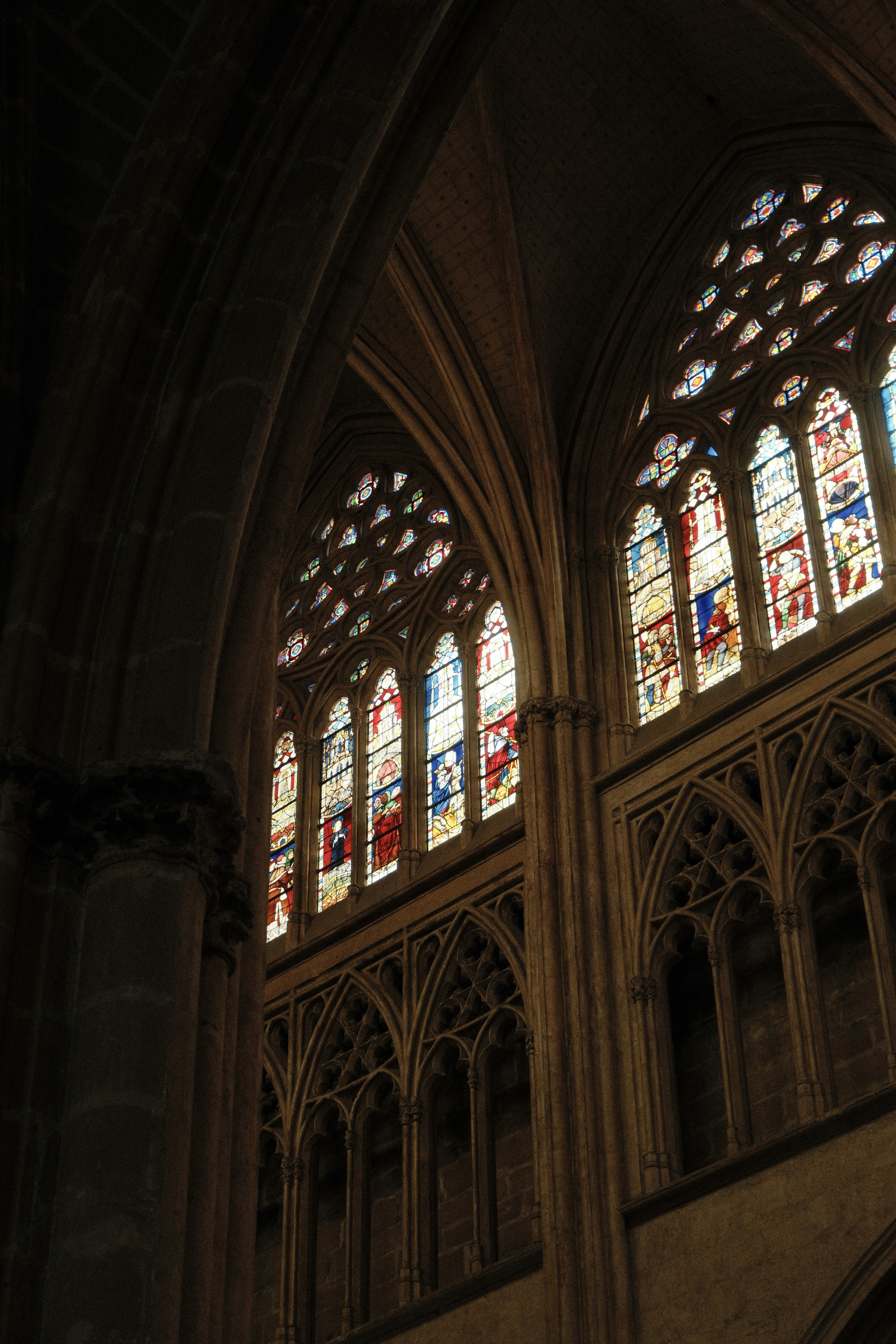 Stained Glass Choir Arches Bathed in Dim Cathedral Light