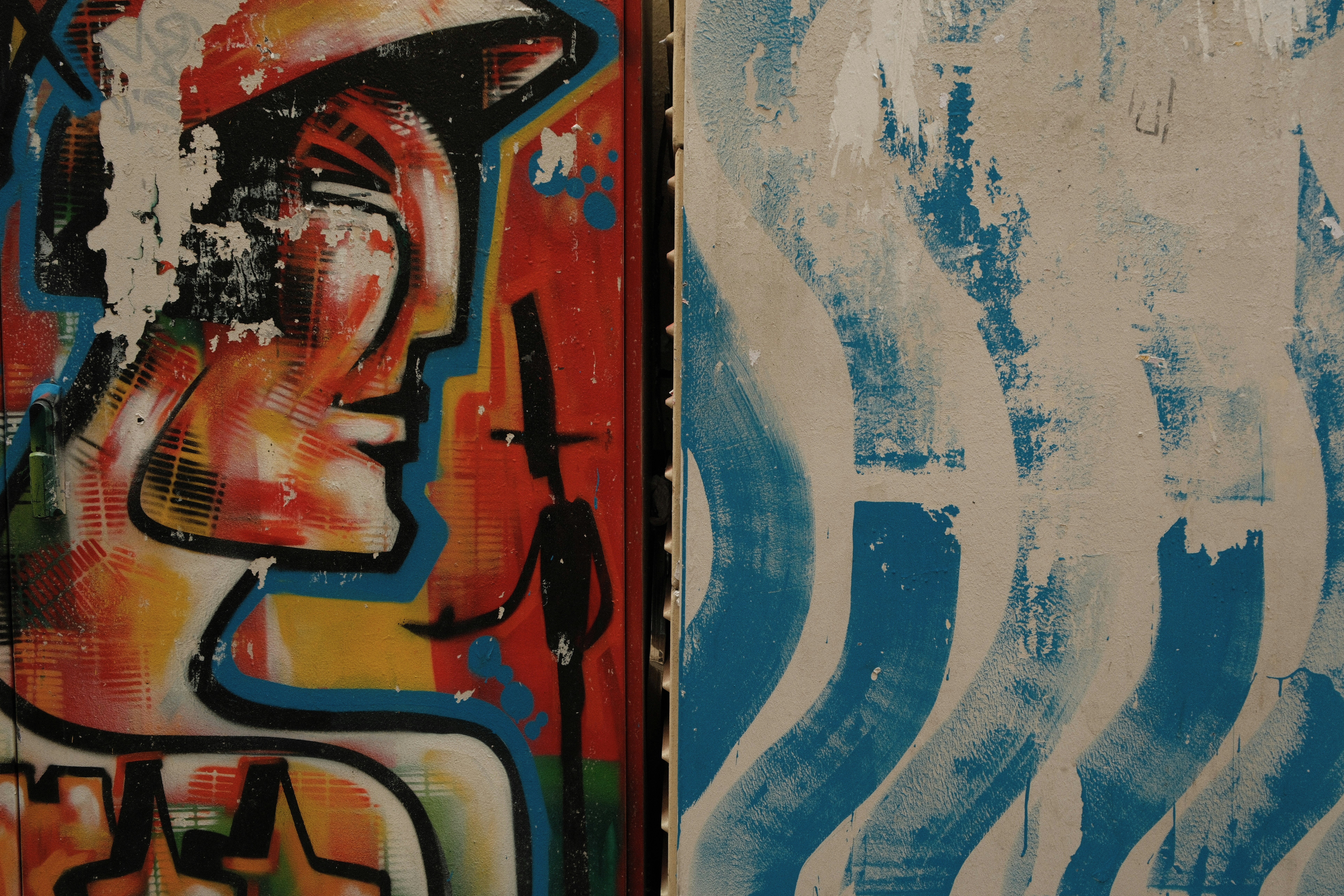 Split Color: A Graffiti Echo Between Red Lock and Ocean Blue