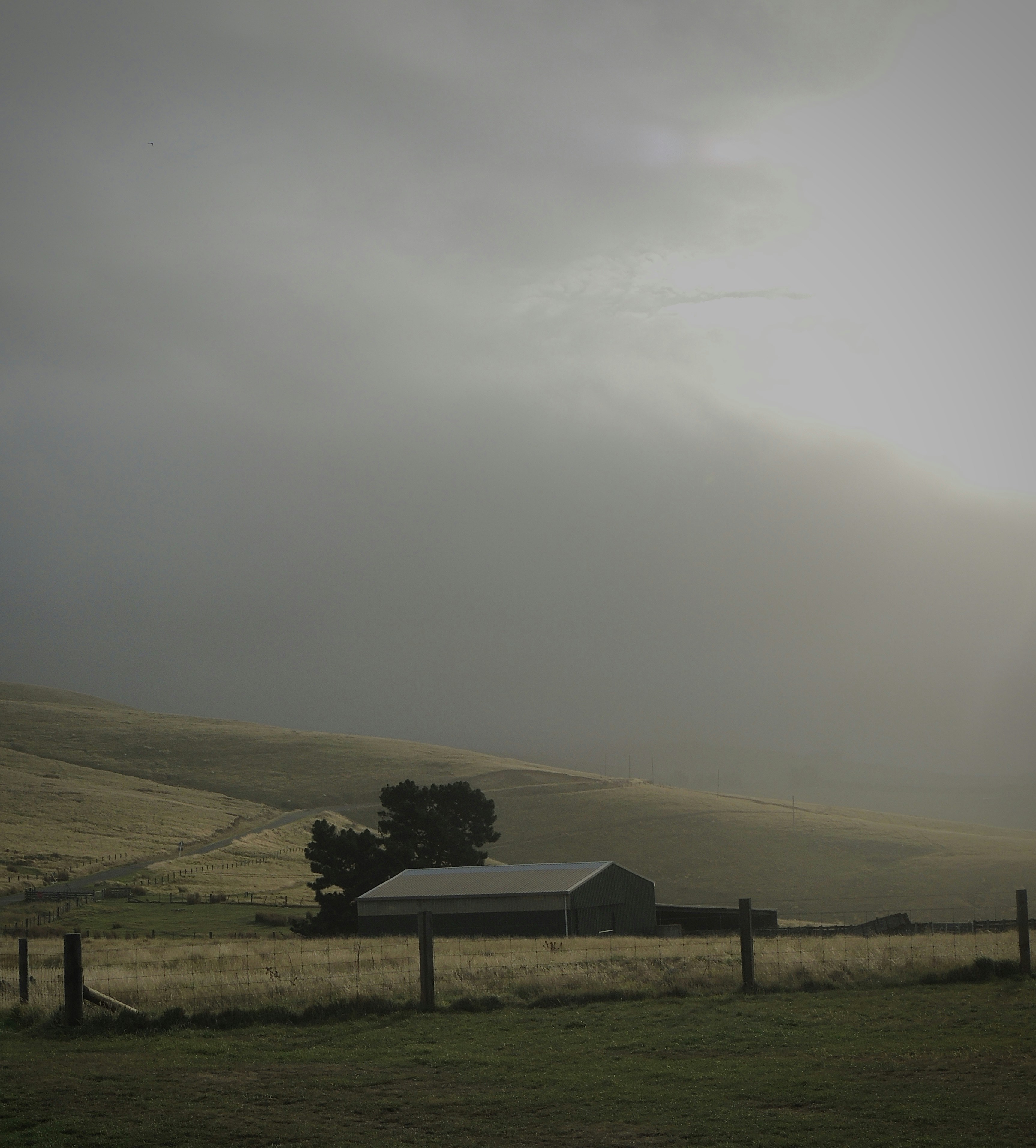 Quiet Barn Under Storm-Glazed Sky