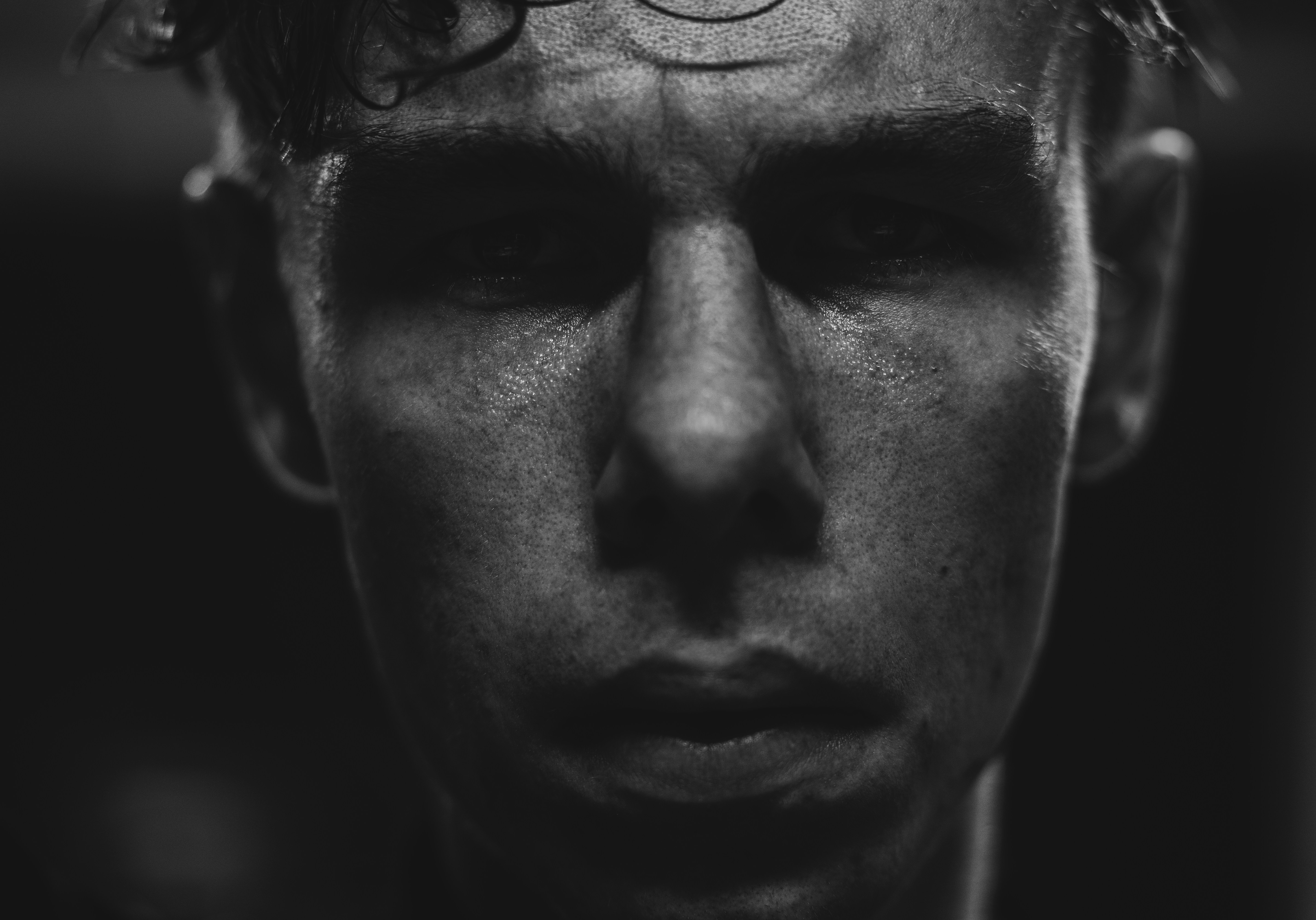 Shadowed Gaze: A Close-Up in Black and White