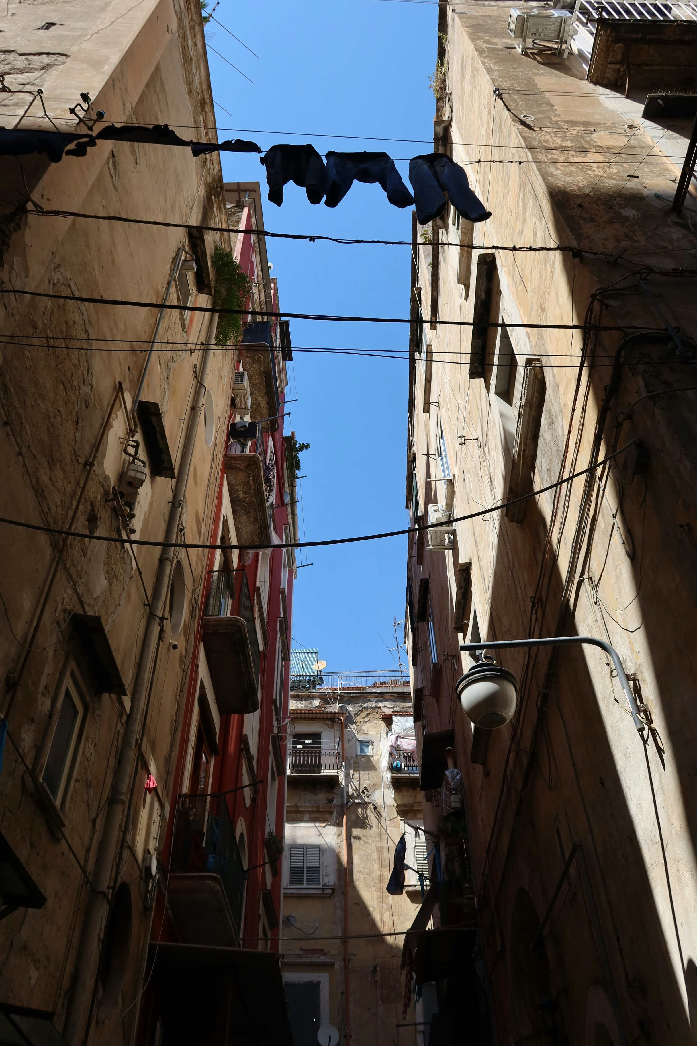 Skyward Gap: Narrow Alley Upside Down Between Crumbling Walls