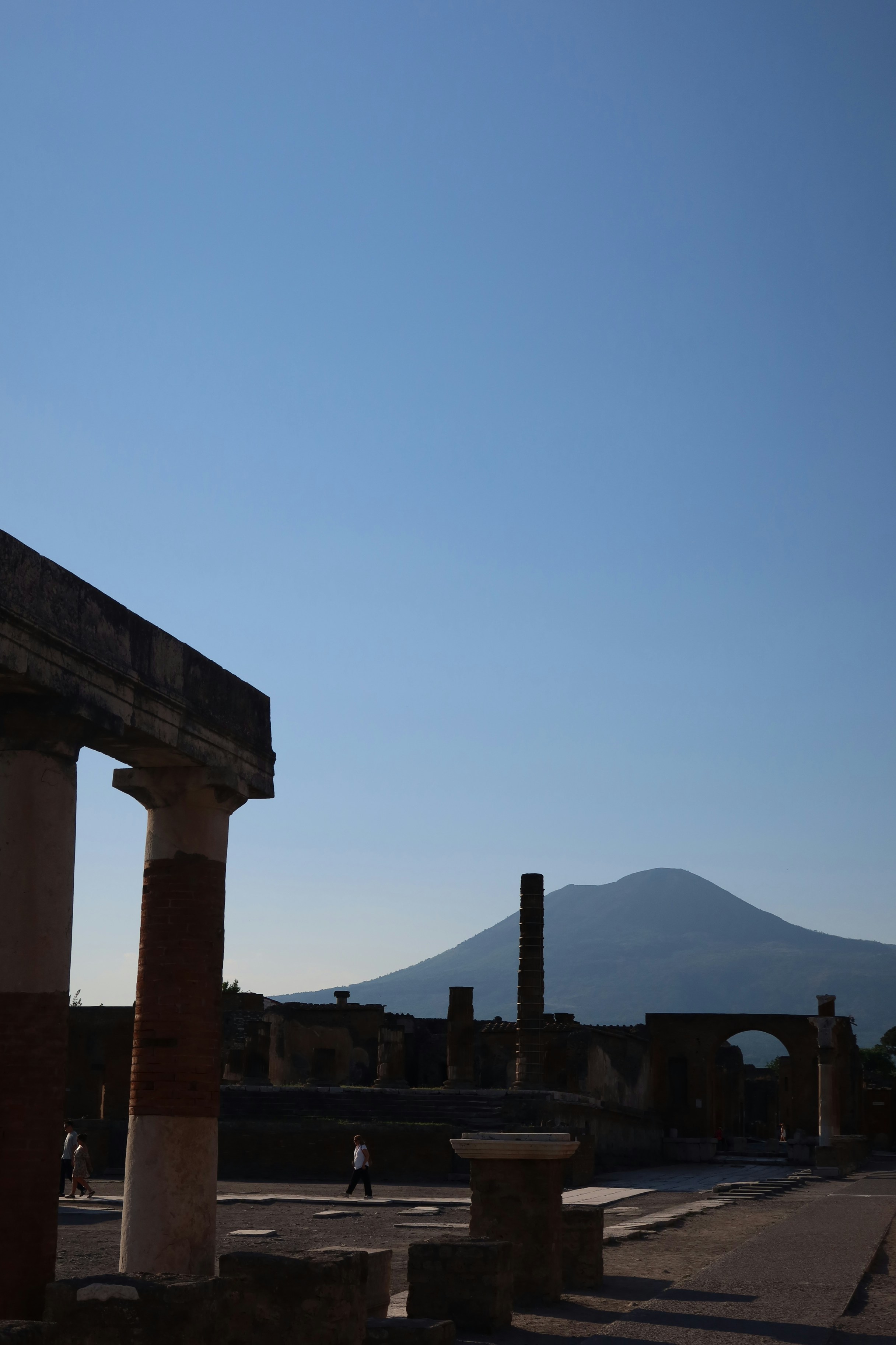 Ancient Ruins Framed by Vantage of Mount Vesuvius at Dusk