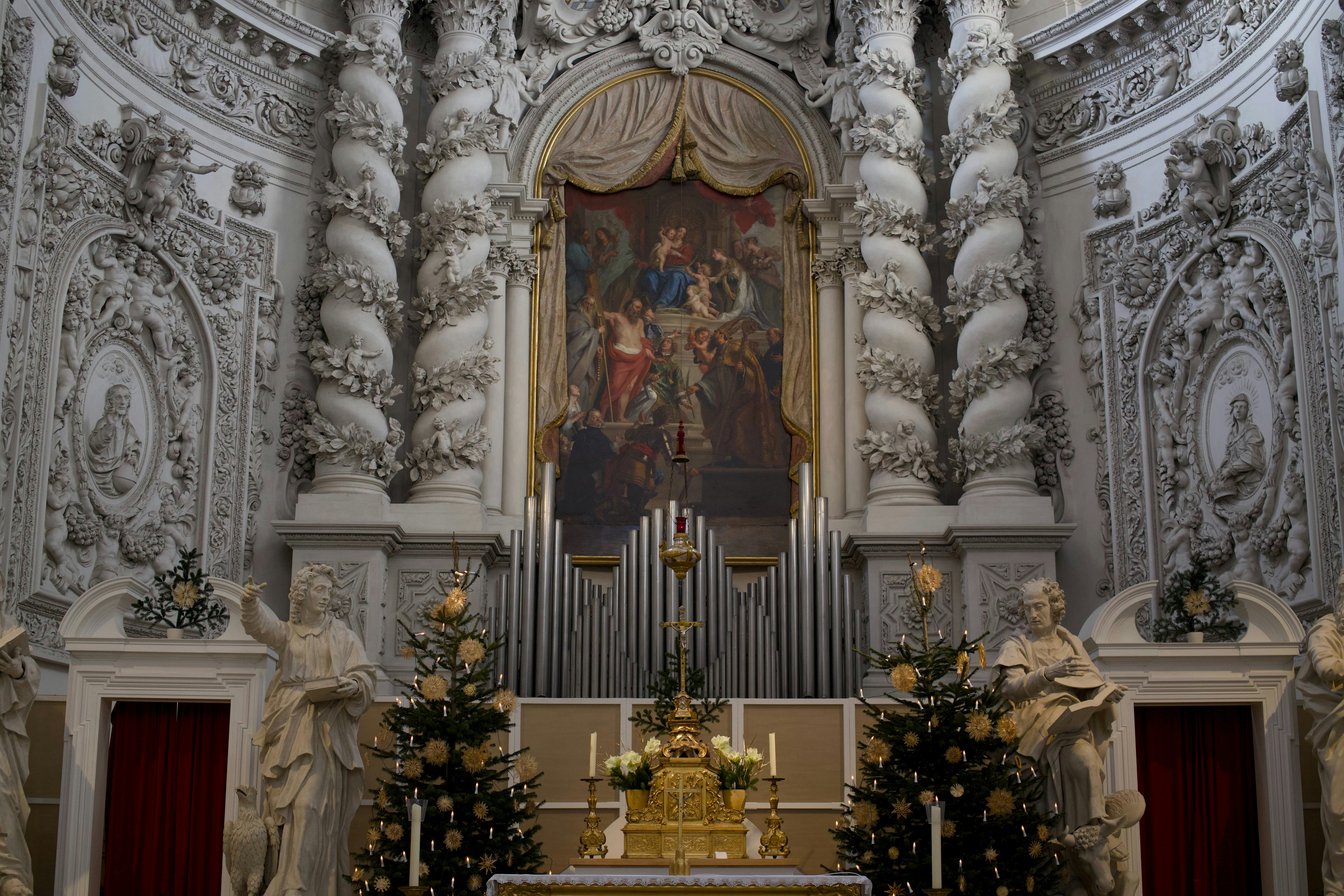 Altar of Light: Ornate Baroque Sanctuary Framing a Central Crucifix