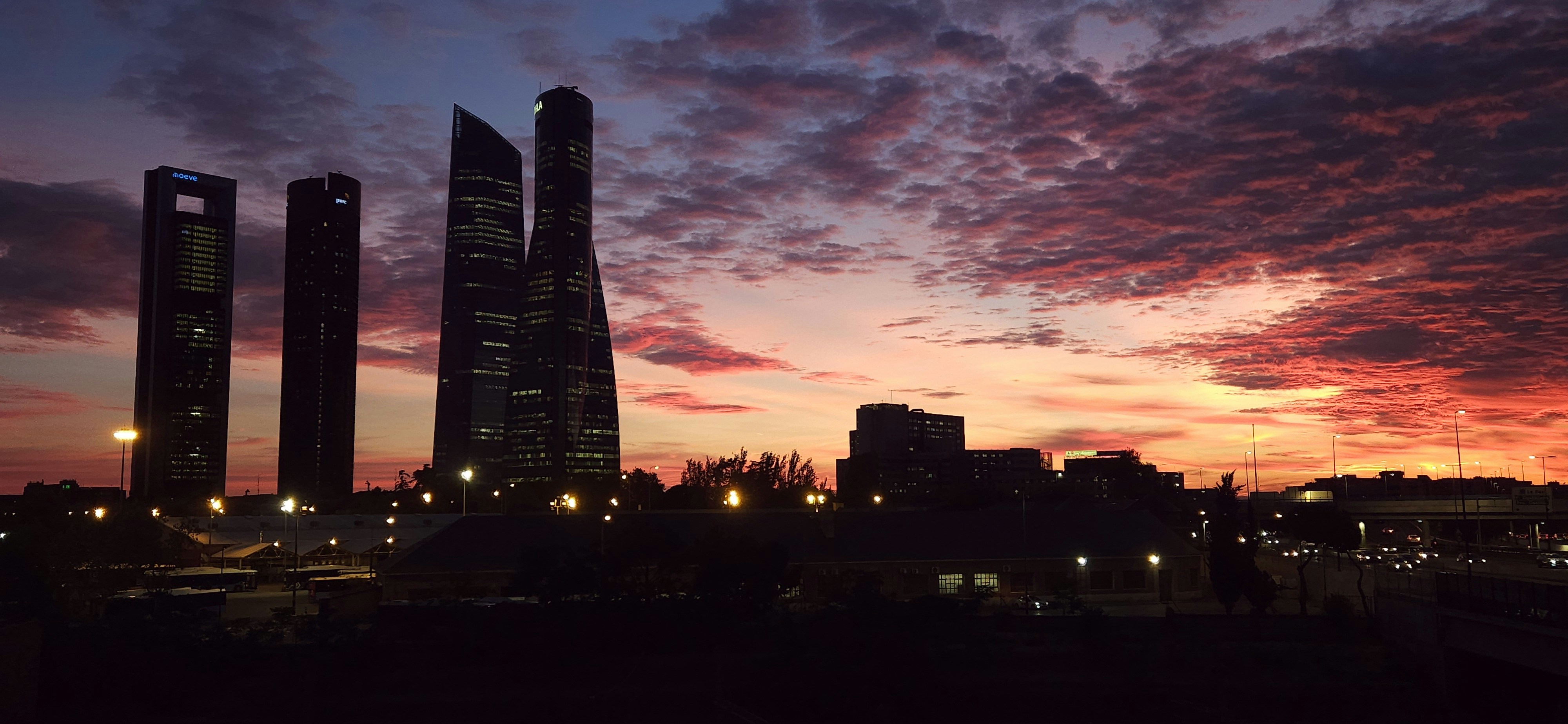 Dusk Skyline: Twin Towers Against a Fiery Horizon