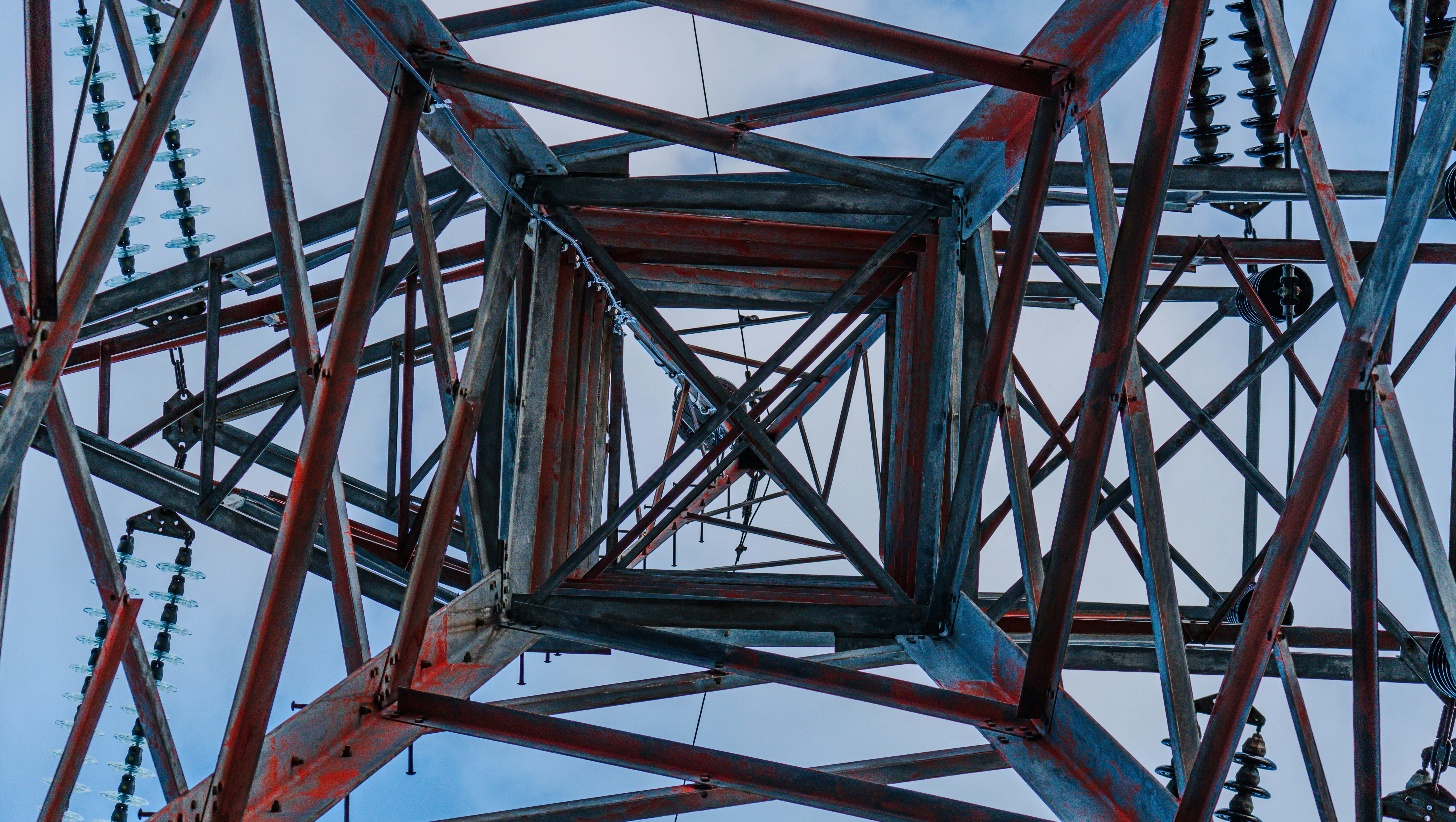 Crisscrossed Geometry: A Cold Blue Structure Framing the Sky