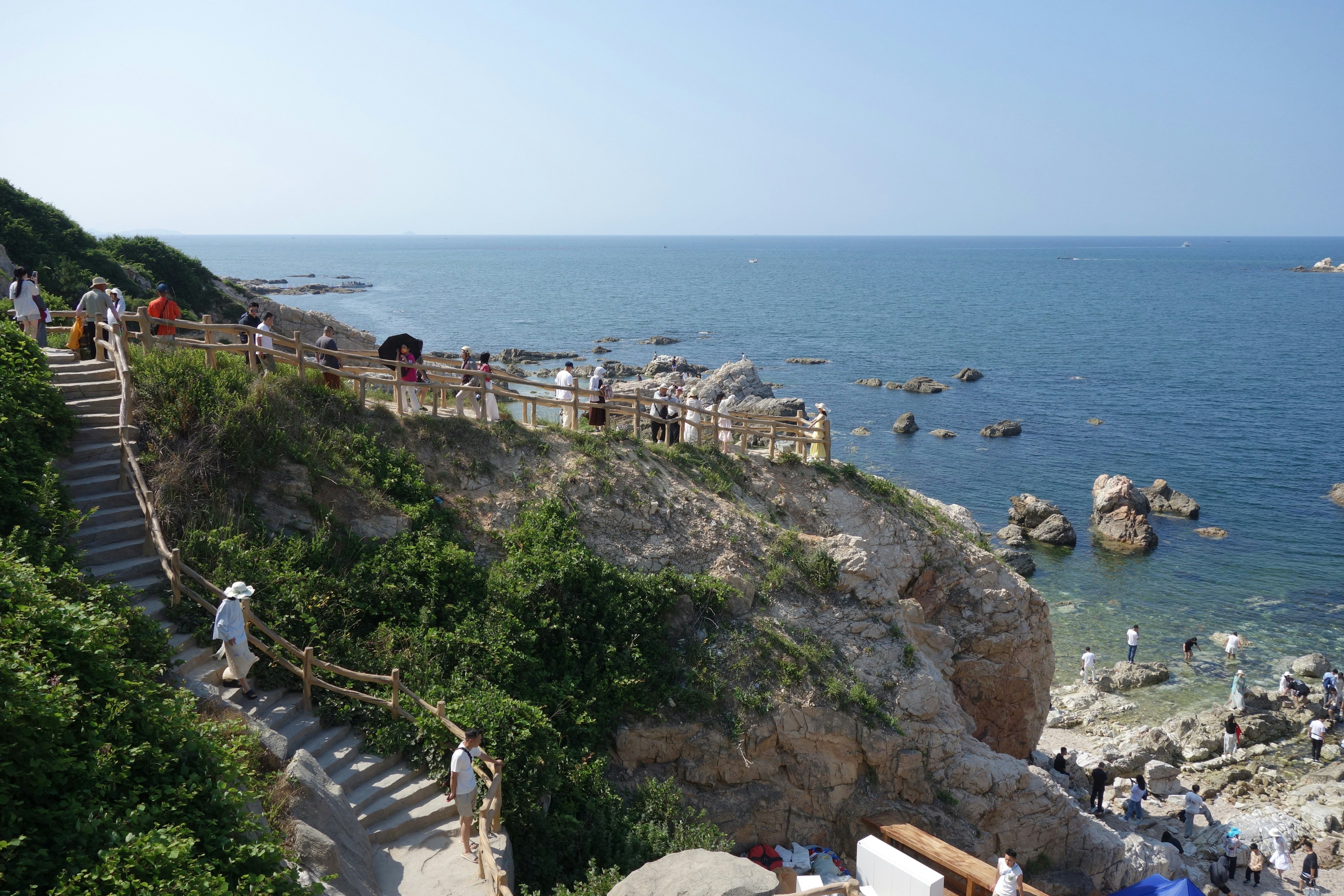 Clifftop Walkway Overlooking a Sunlit Sea