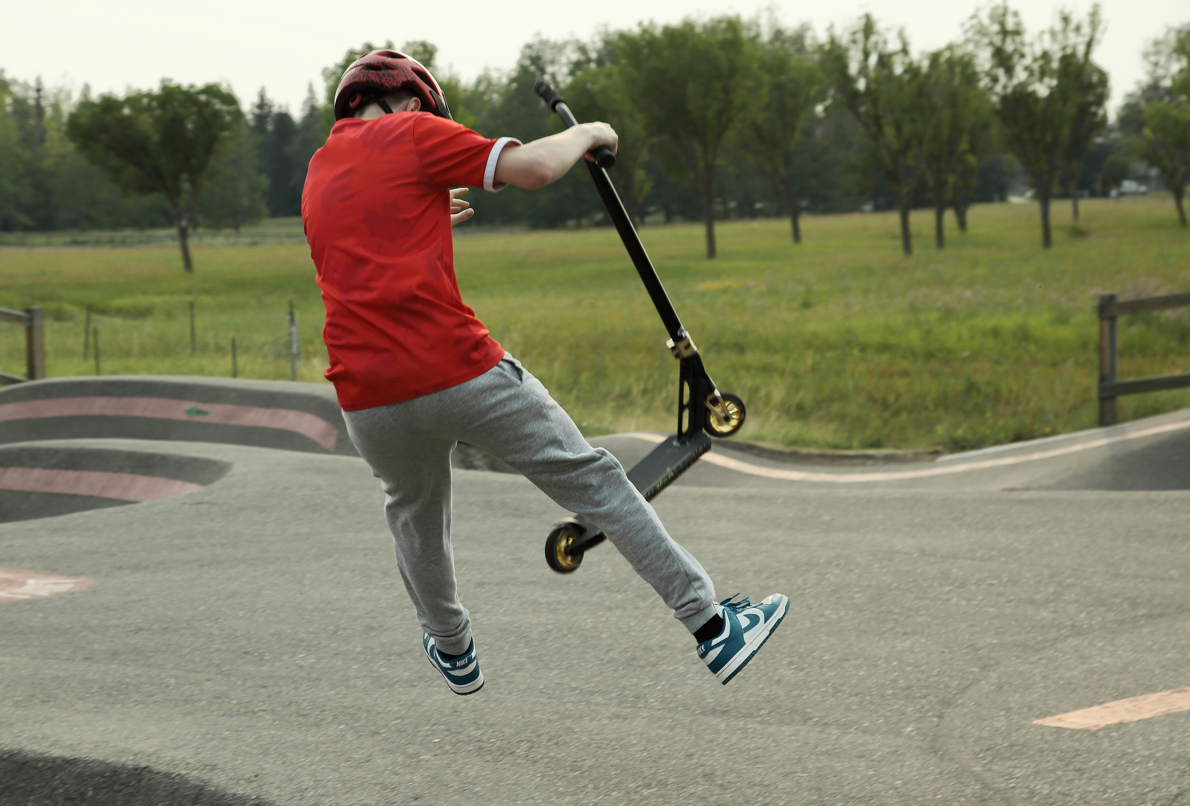 Leap at the Park: A Red-Jersey Rider Defies Gravity