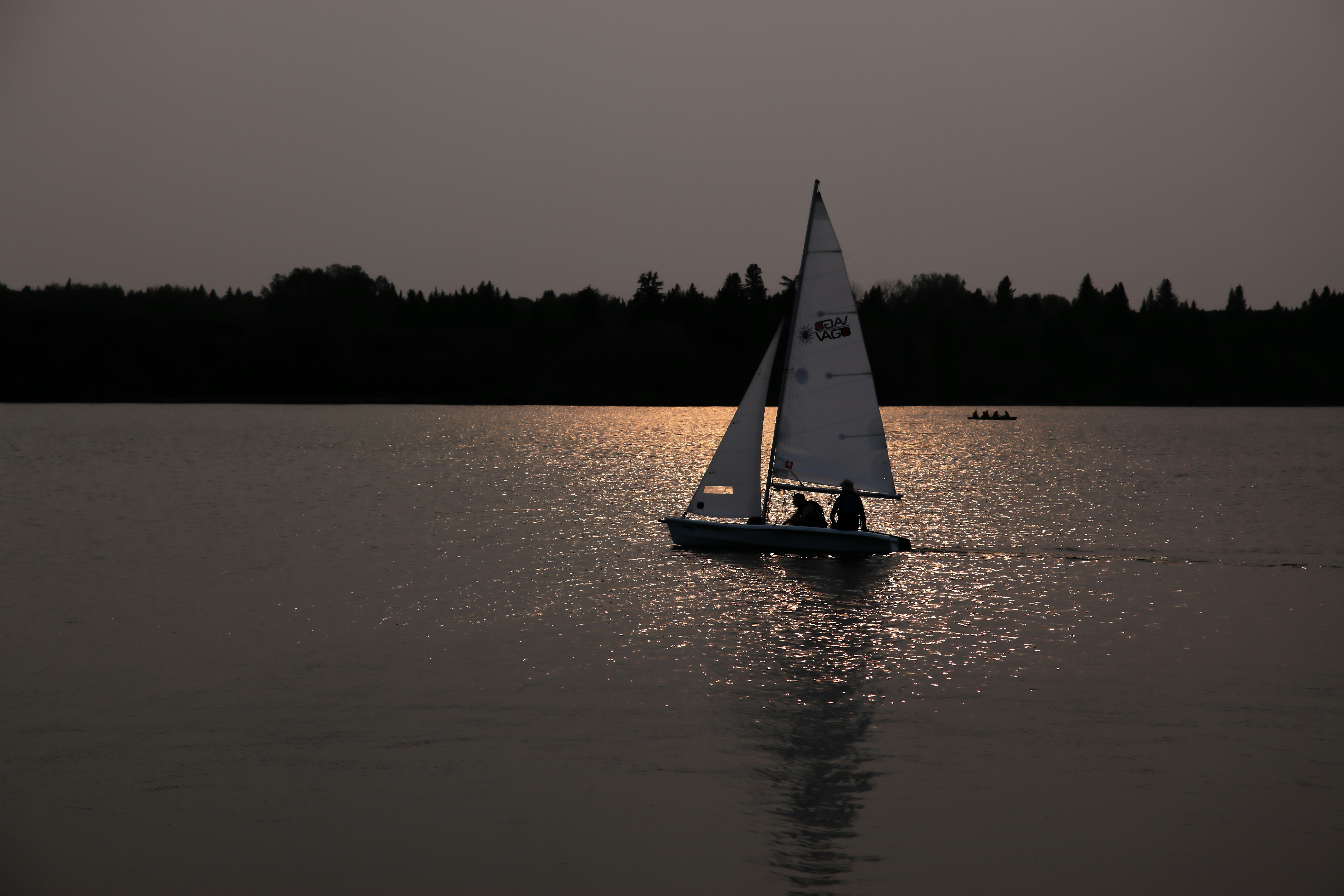 Sailboat in the Glowing Dusk: A Quiet Lake Silhouette