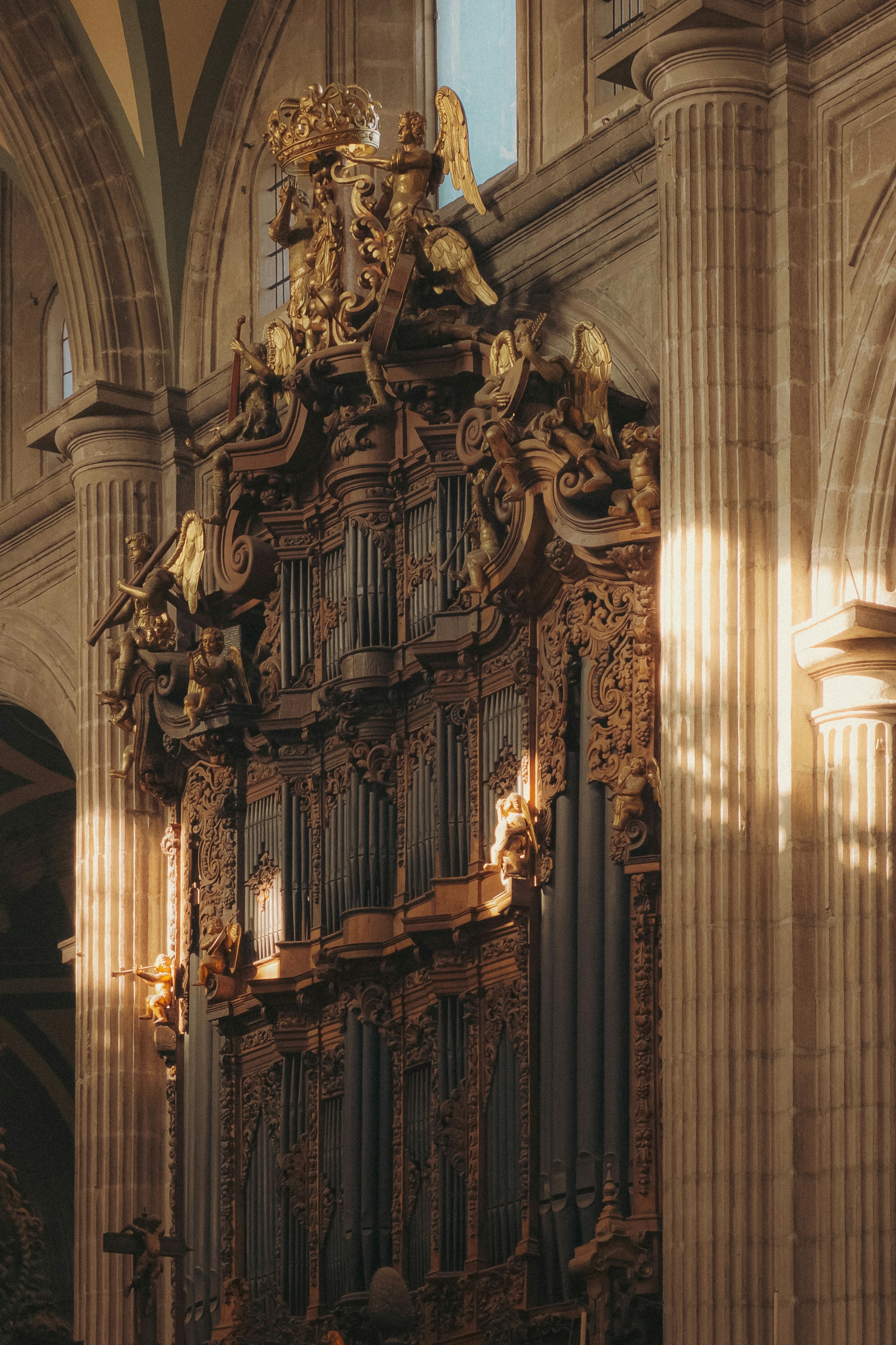 Gold-crest Carved Organ Loft in Warm Cathedral Light
