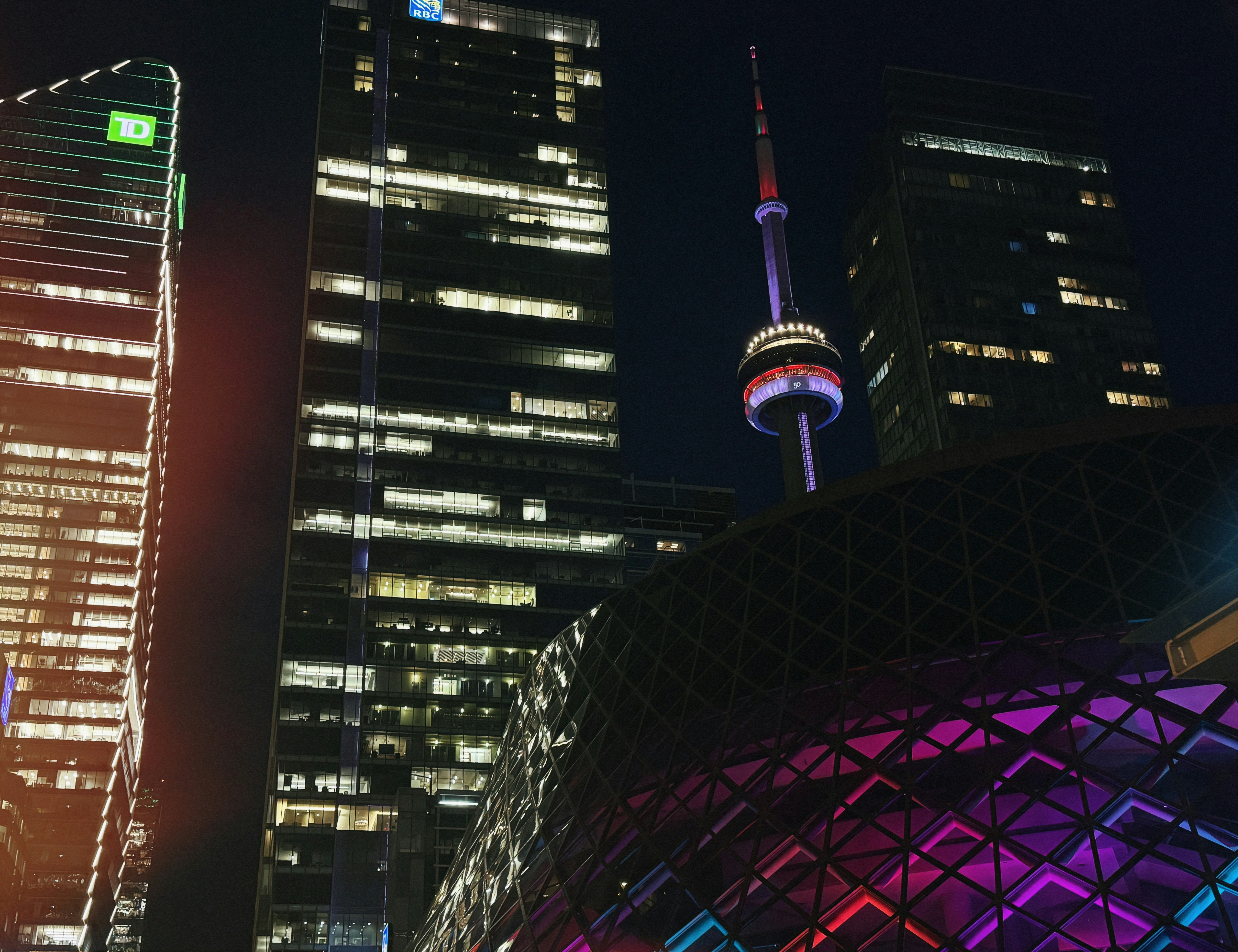 Midnight Plateau: Neon Facade and Tower Light