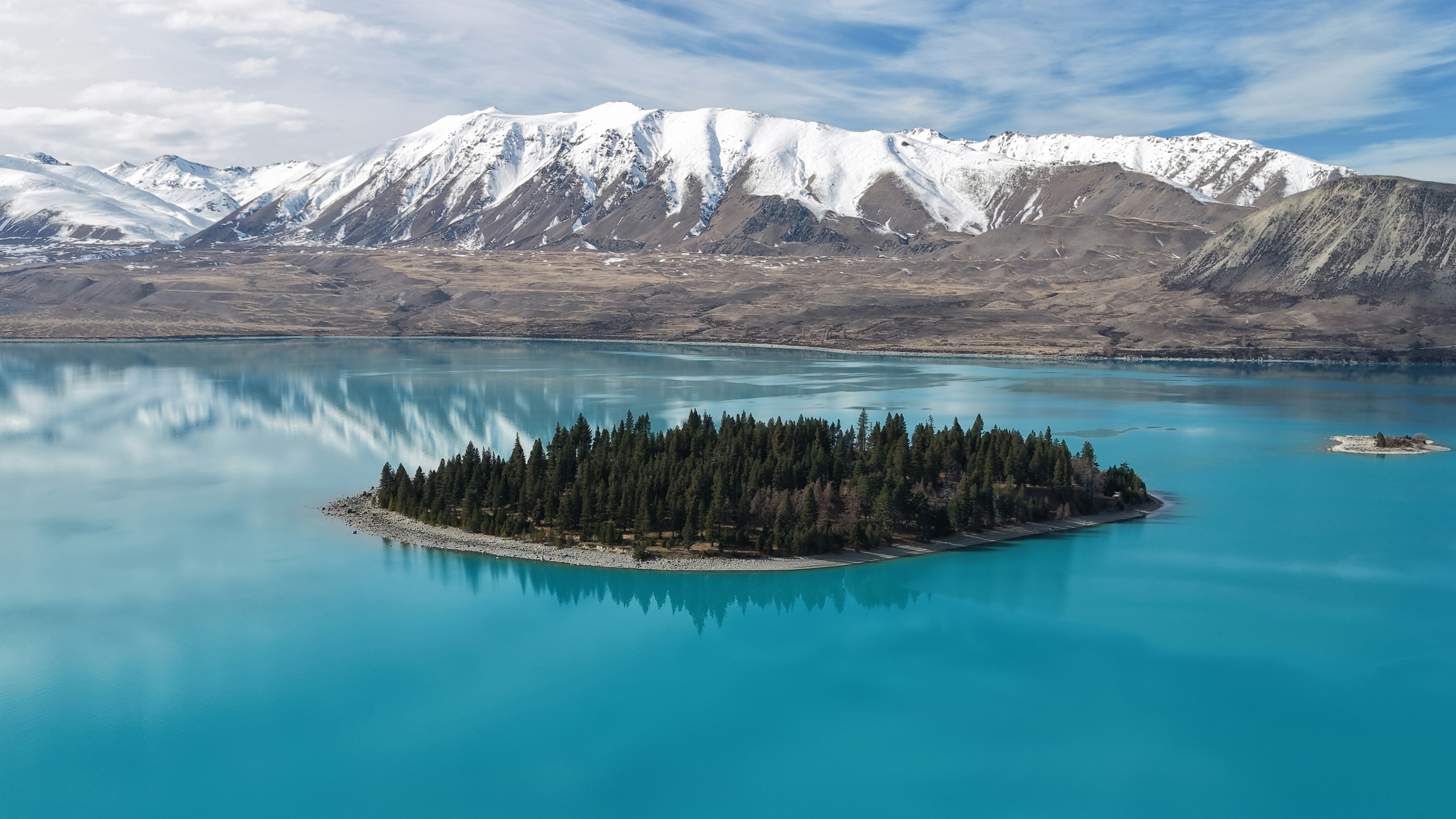 Azure Lagoons: Island Refuge Amid Snowcapped Giants