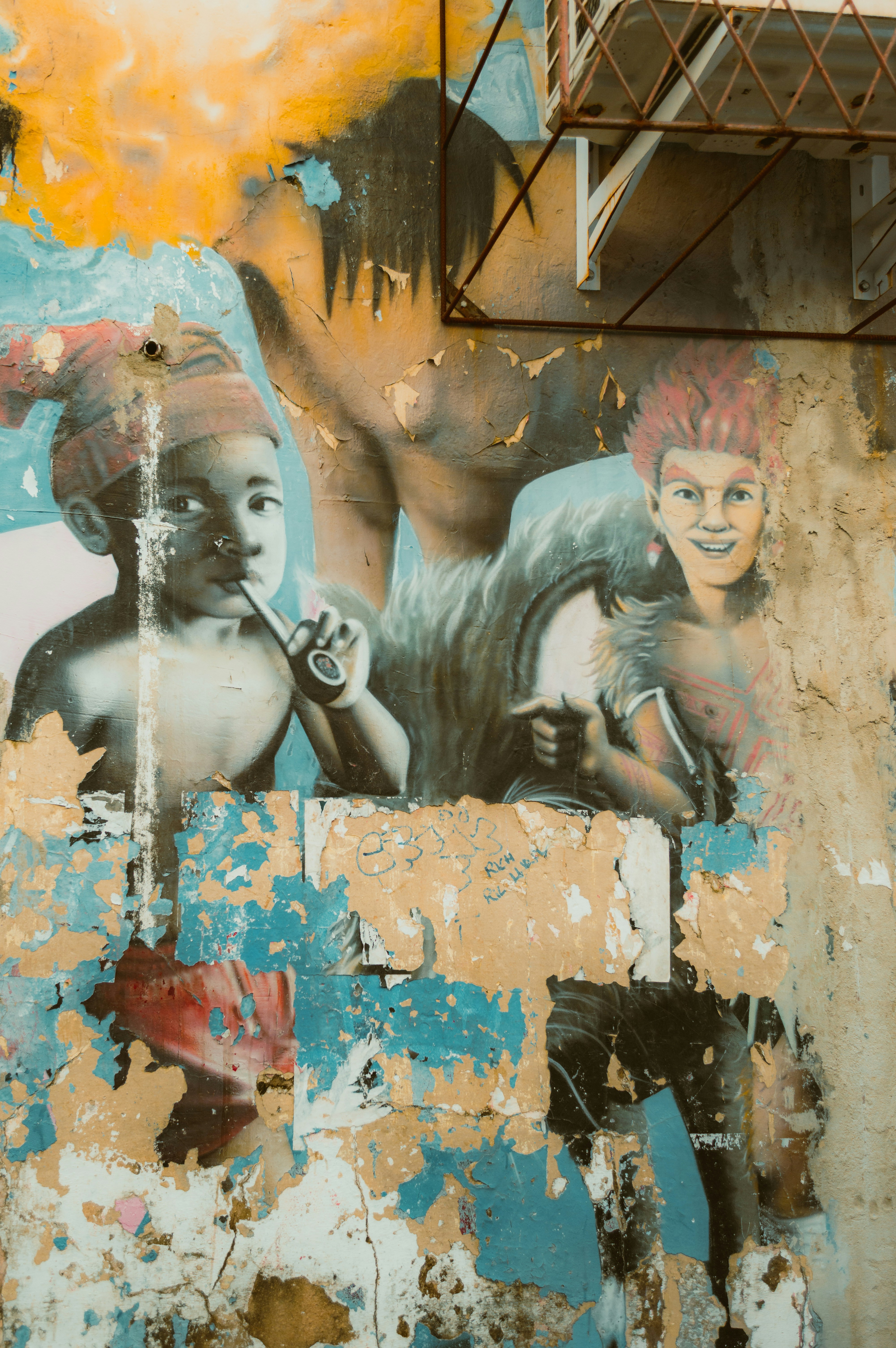 Fragments of Color: A Crumbling Mural of Youthful Graffiti