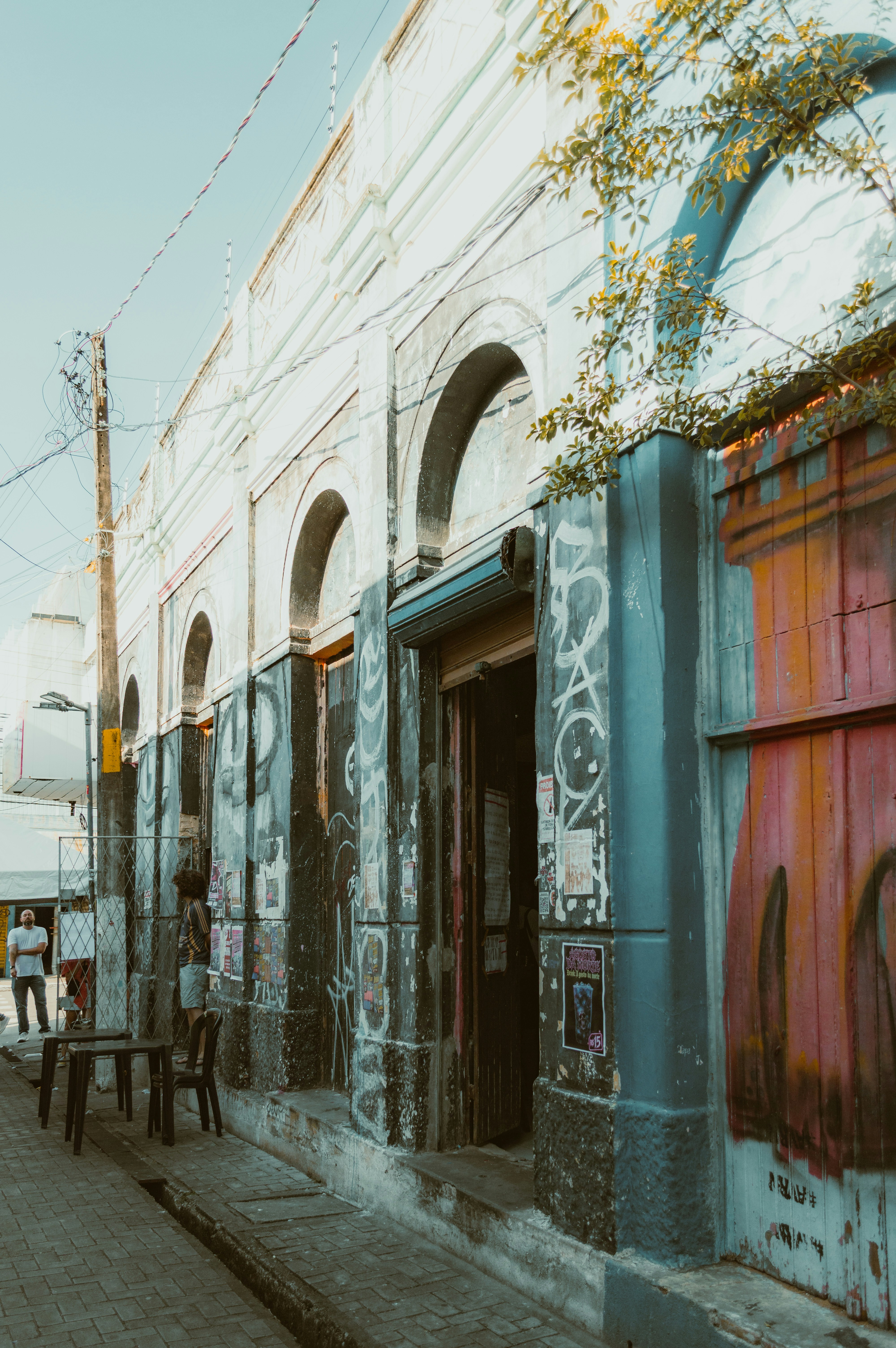 Graffiti-Textured Arcade facade under a sunlit sky