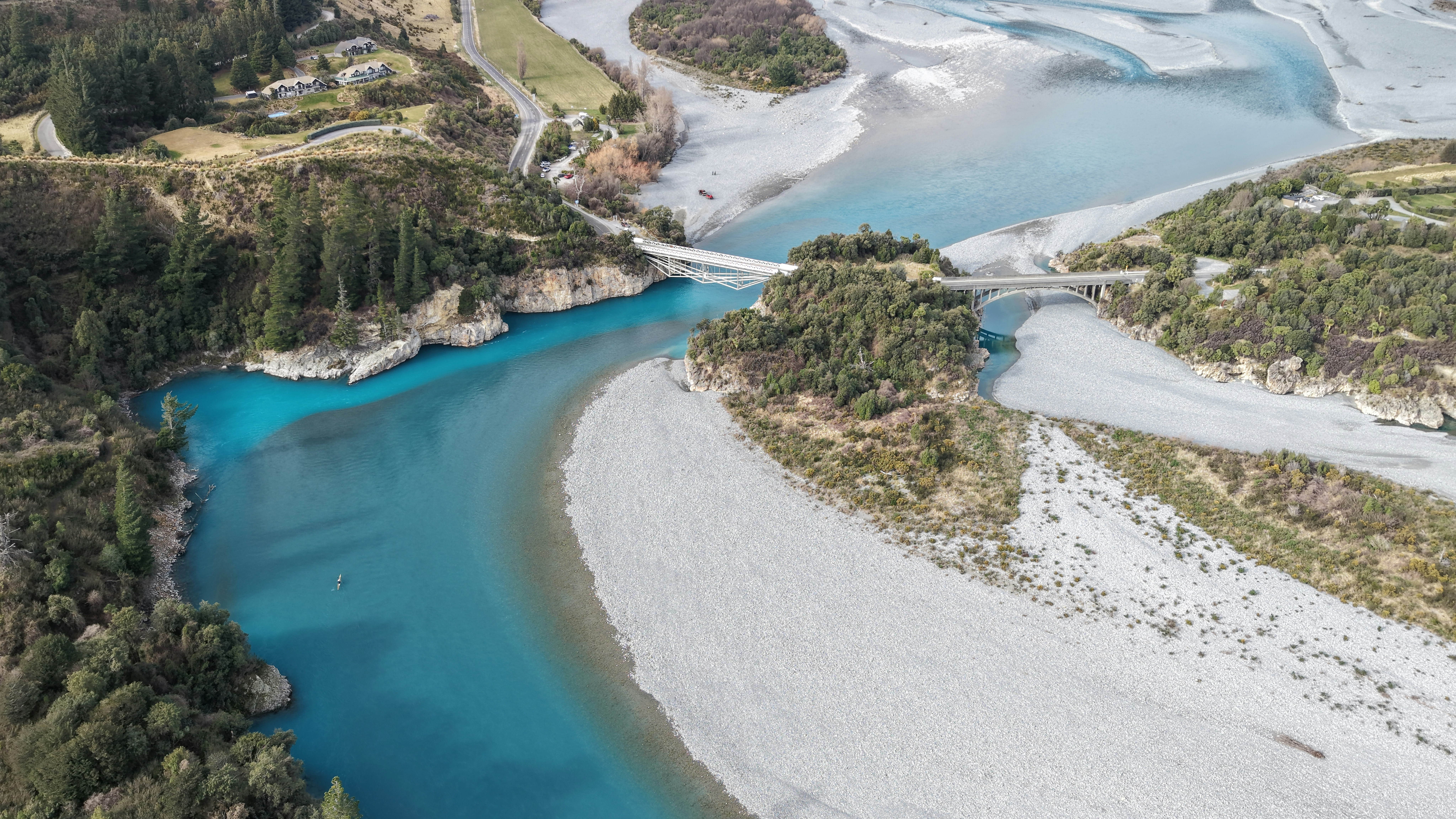 Vivid river bend carved through coastal forest and gravel shoals