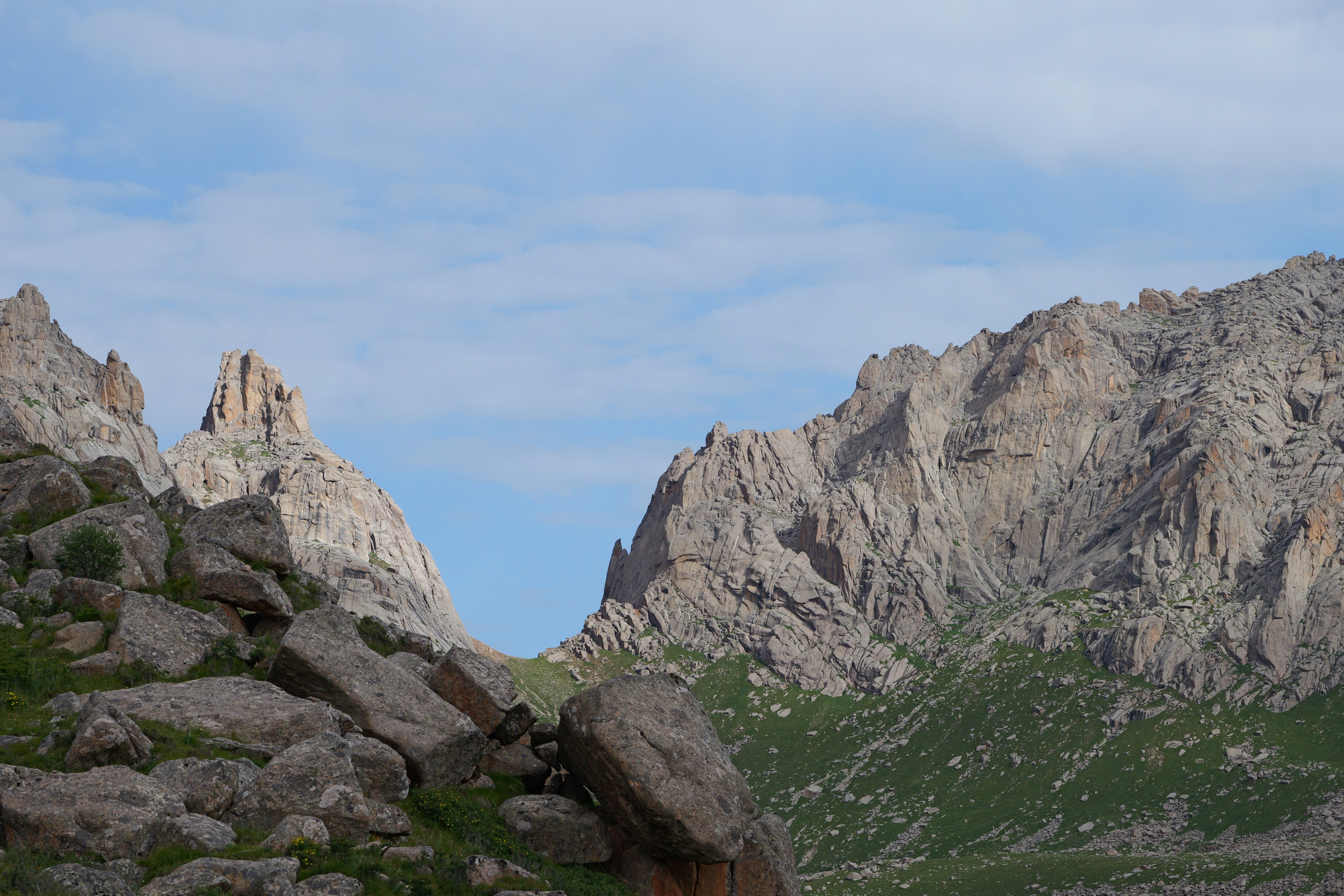 Rugged Alpine Spine Under A Streaked Sky