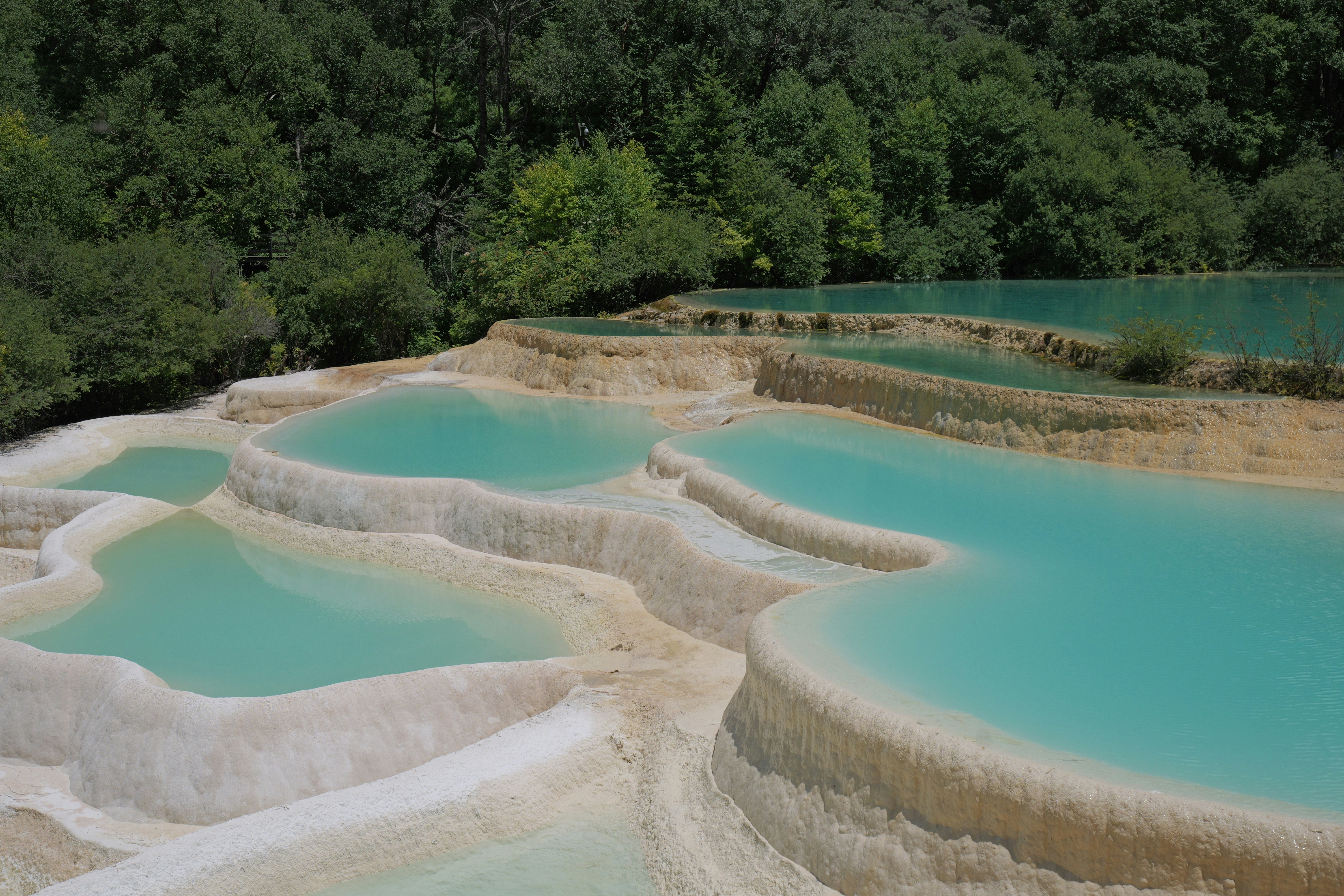 Terraced Turquoise Echoes: A Landscape of Mineral Pools