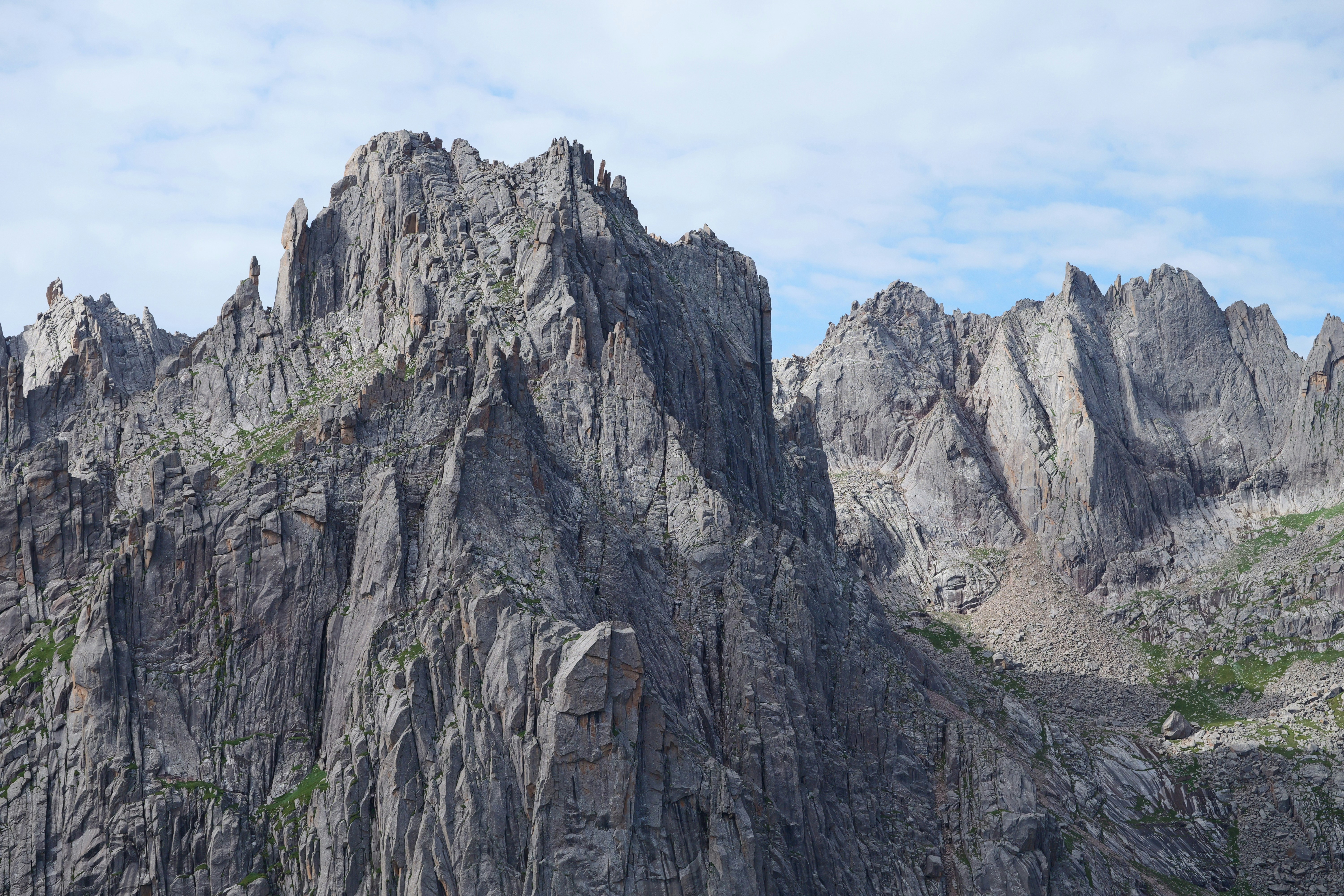 Jagged Sentinel Peaks Under a Quiet Blue Sky