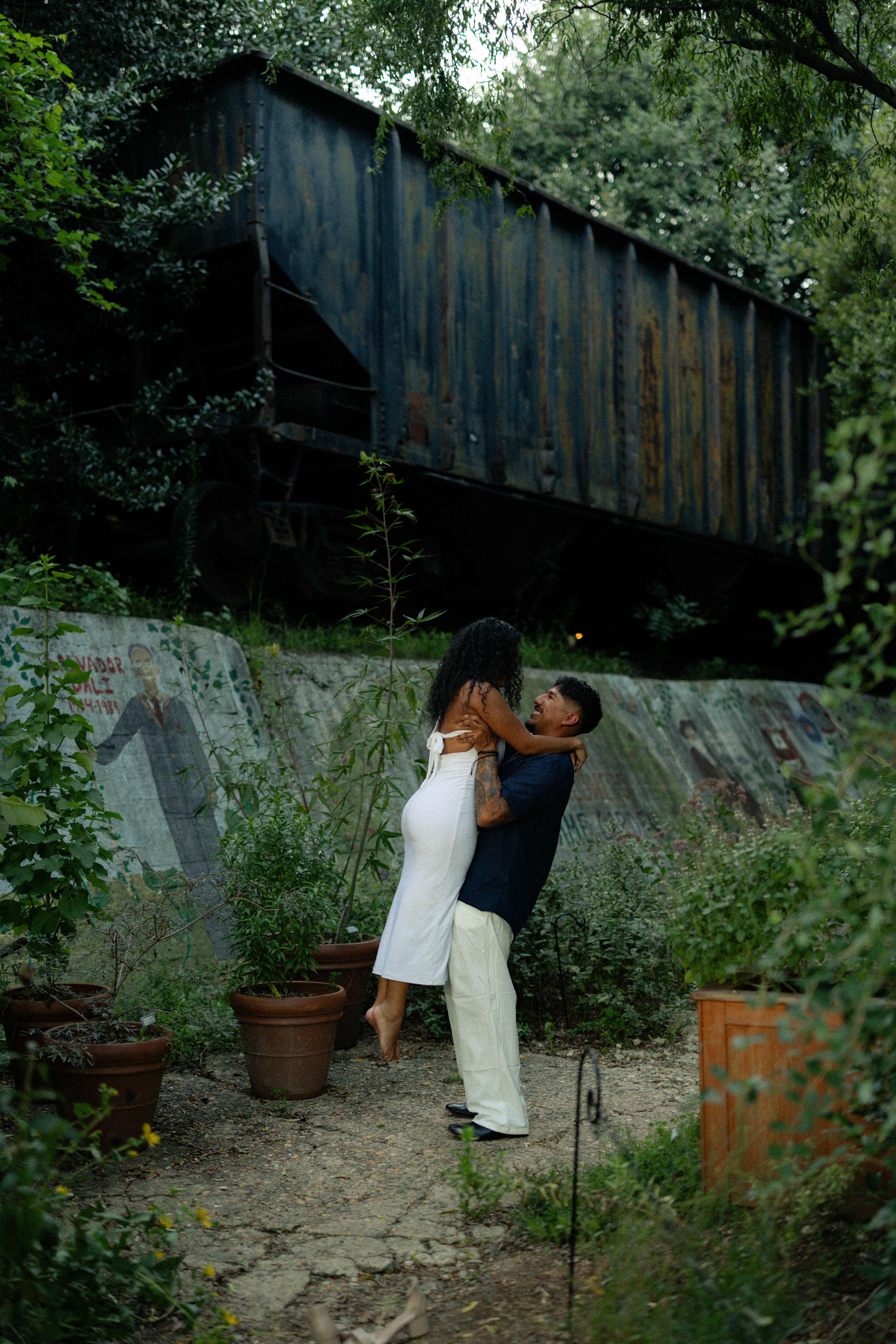 Interlude by the Rails: a Tender Lift beneath a Weathered Span