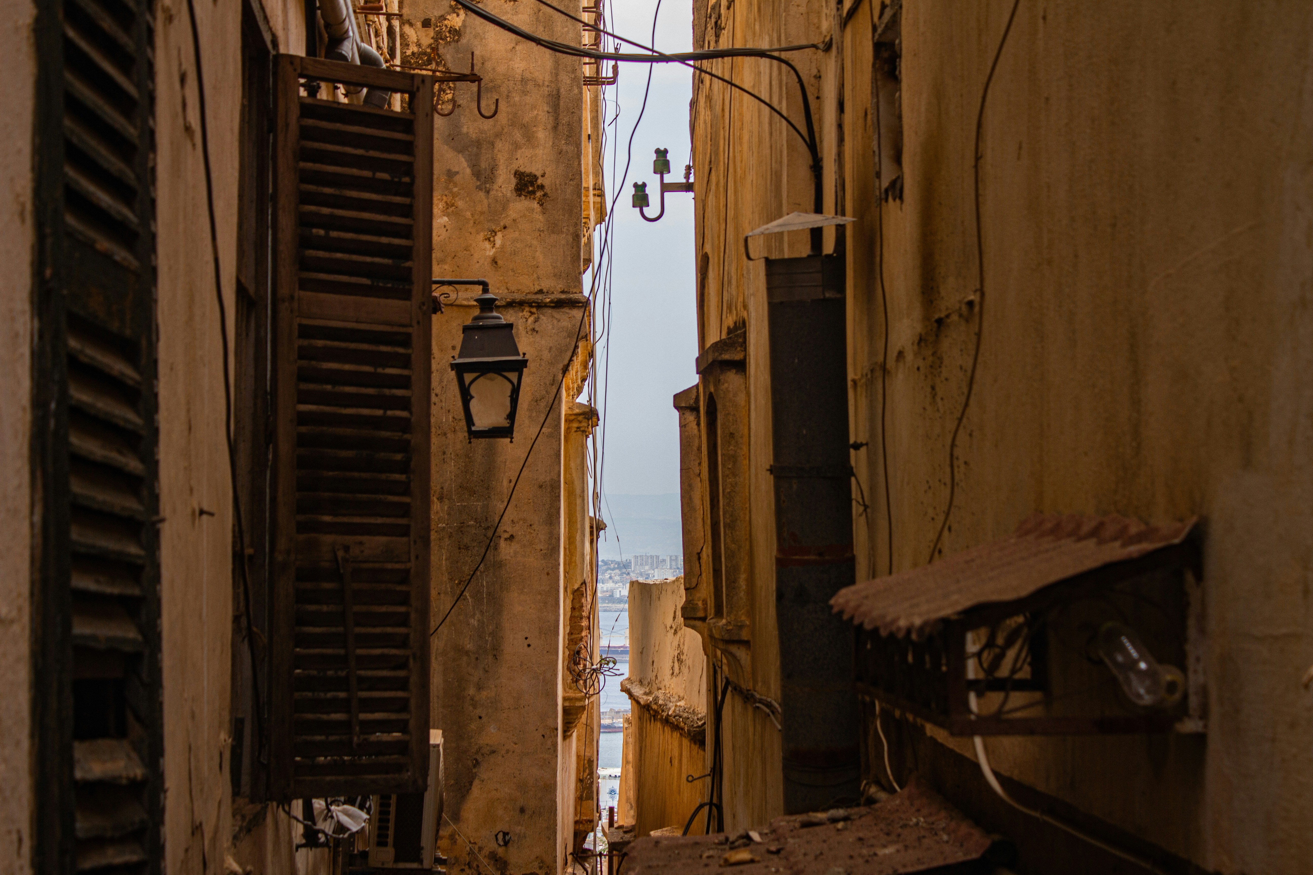 Sunlit Gap: A Quiet Passage Between Weathered Walls