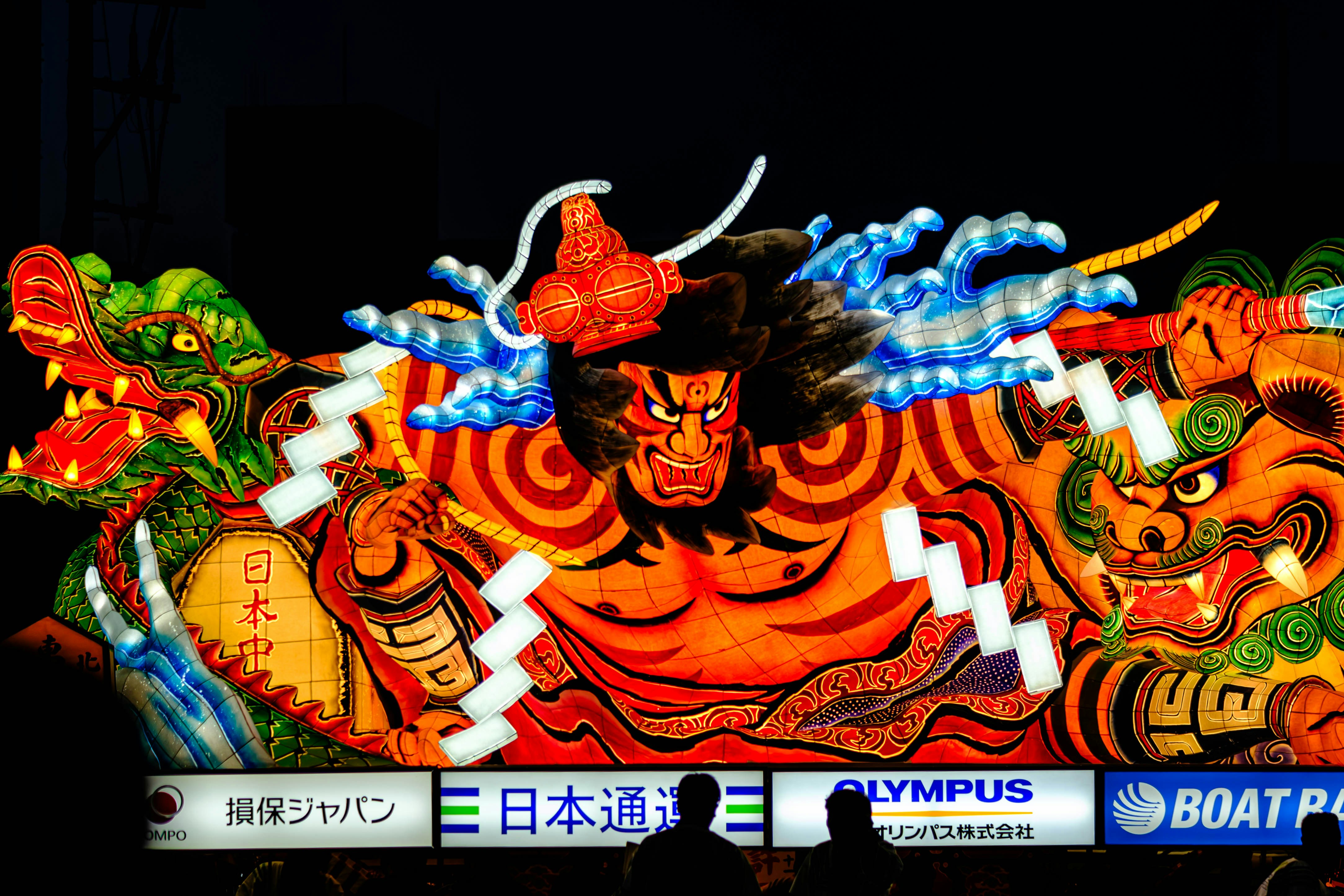 Dragon Parade: Neon Guardian Illuminated at Night