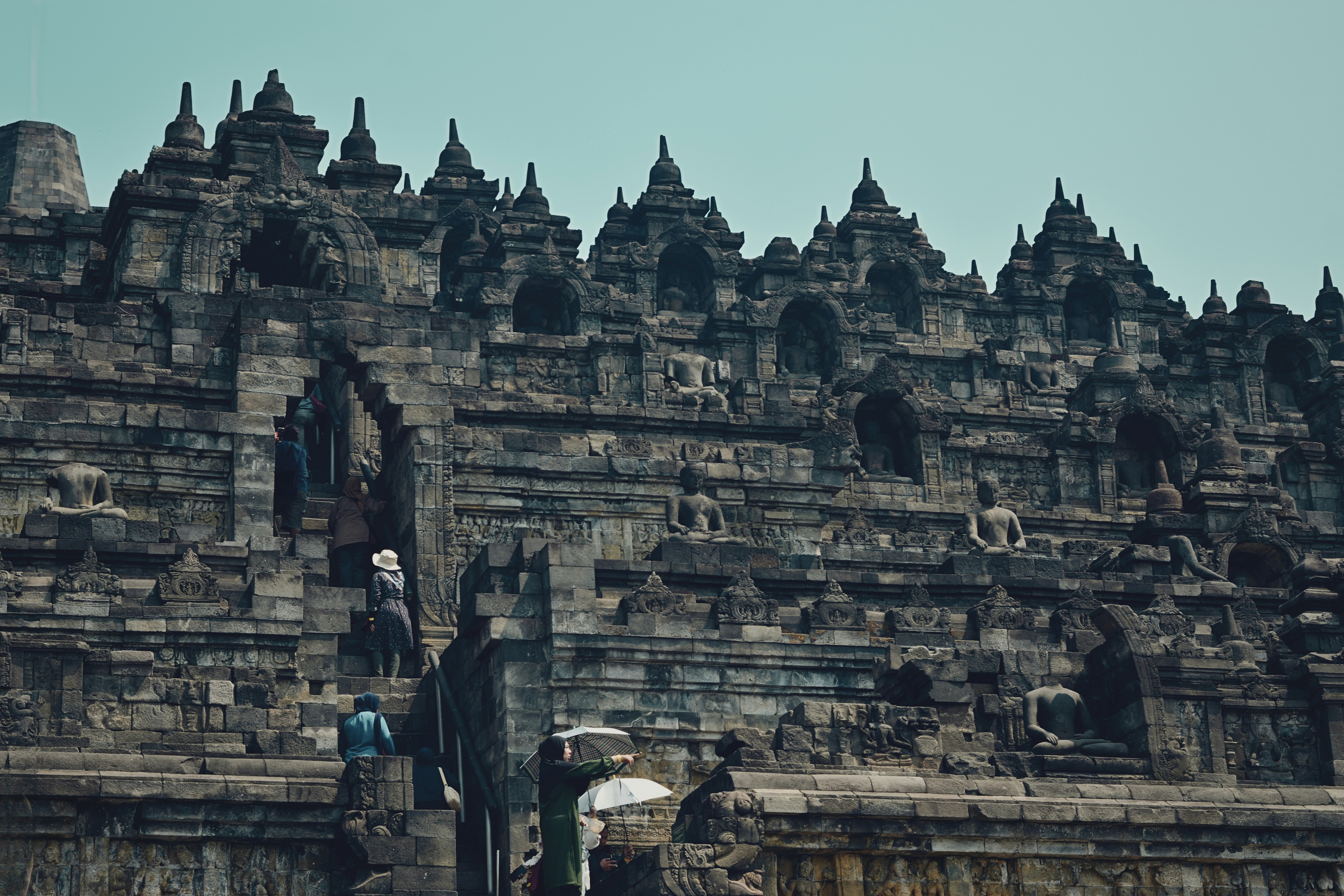 Stone Harmony: Balinese Temple Terrace under a Clear Sky