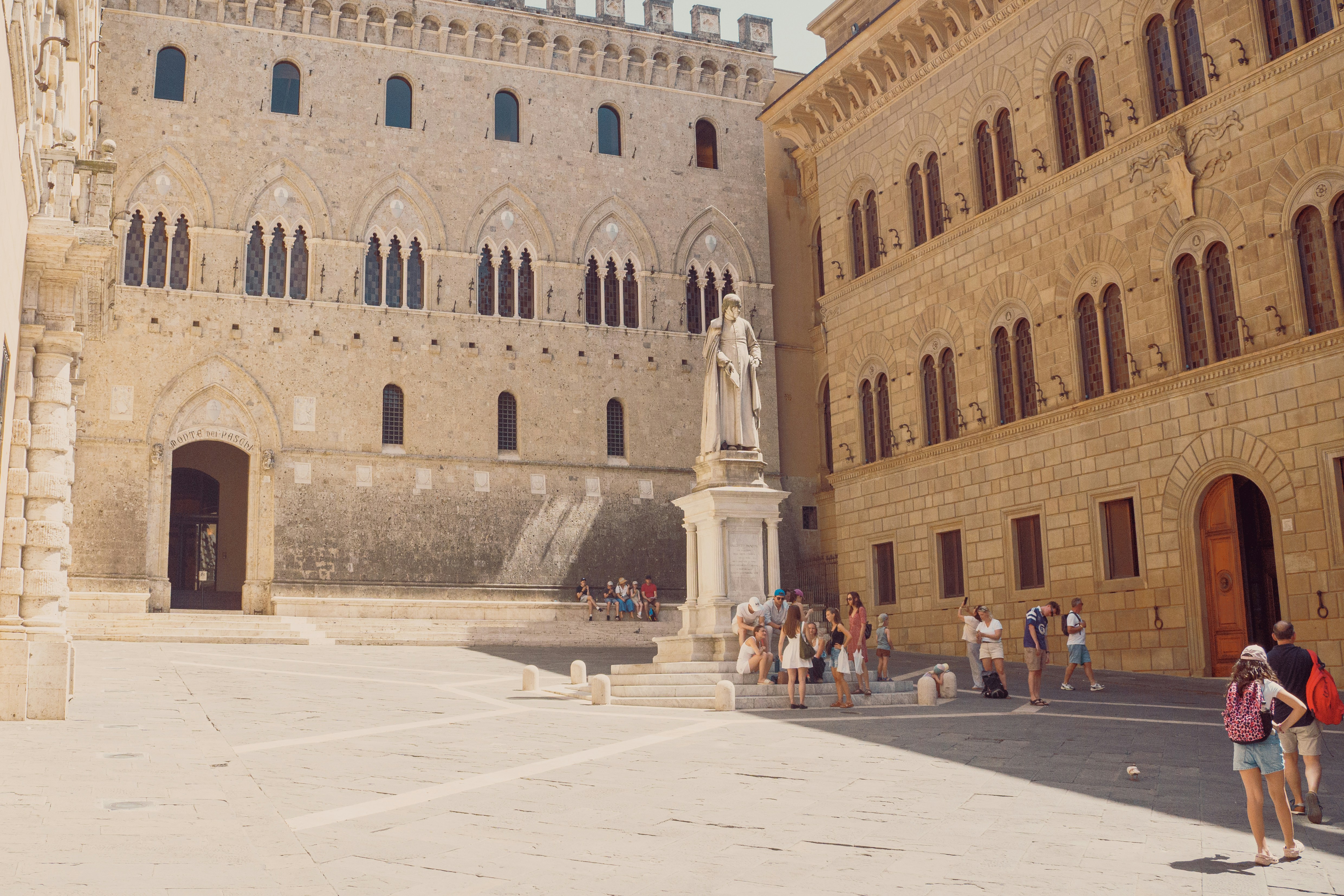 Courtyard Echoes: Statues, Arches, and Sunlit Steps