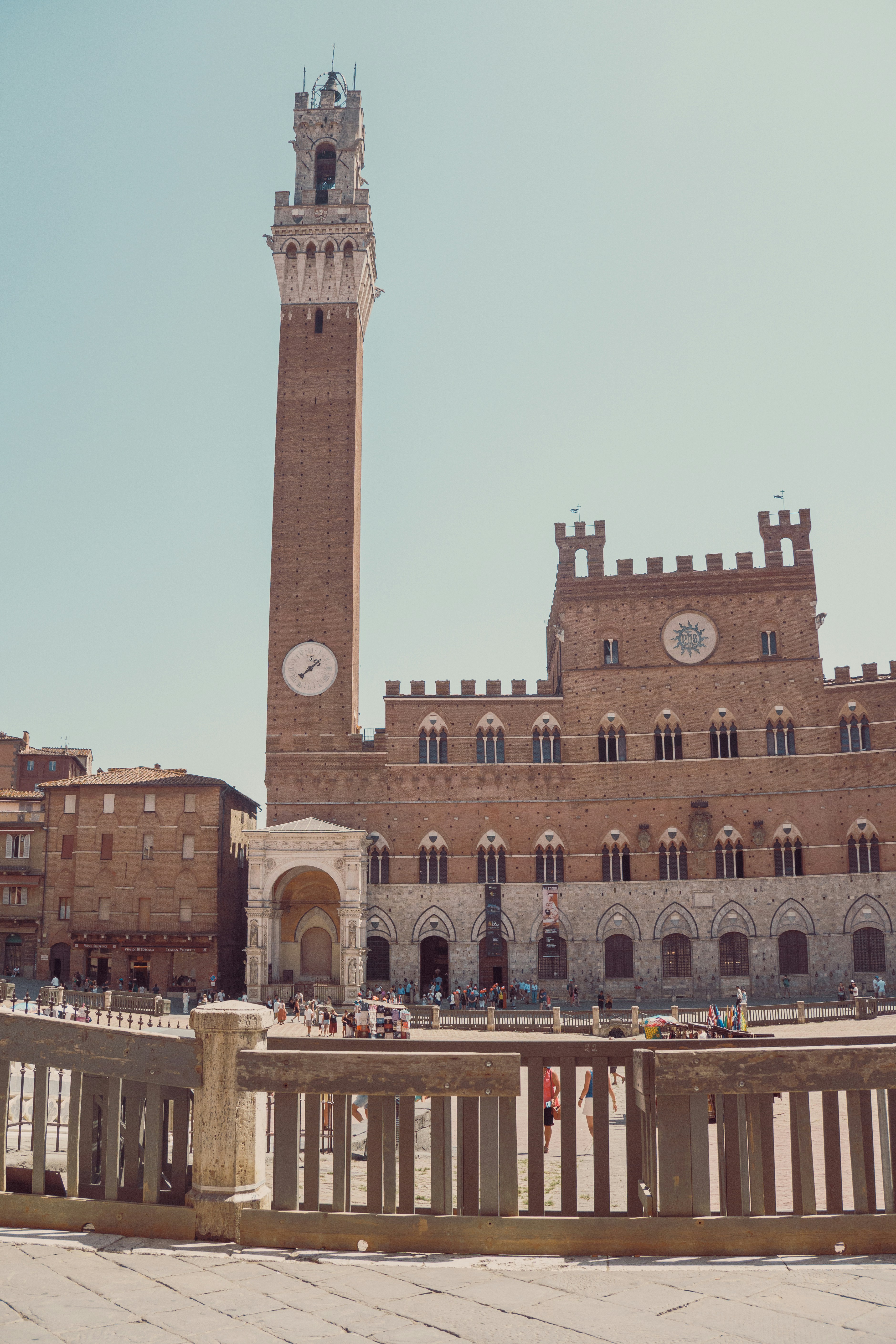 Towering Piazza: A Medieval Silhouette Against a Clear Sky