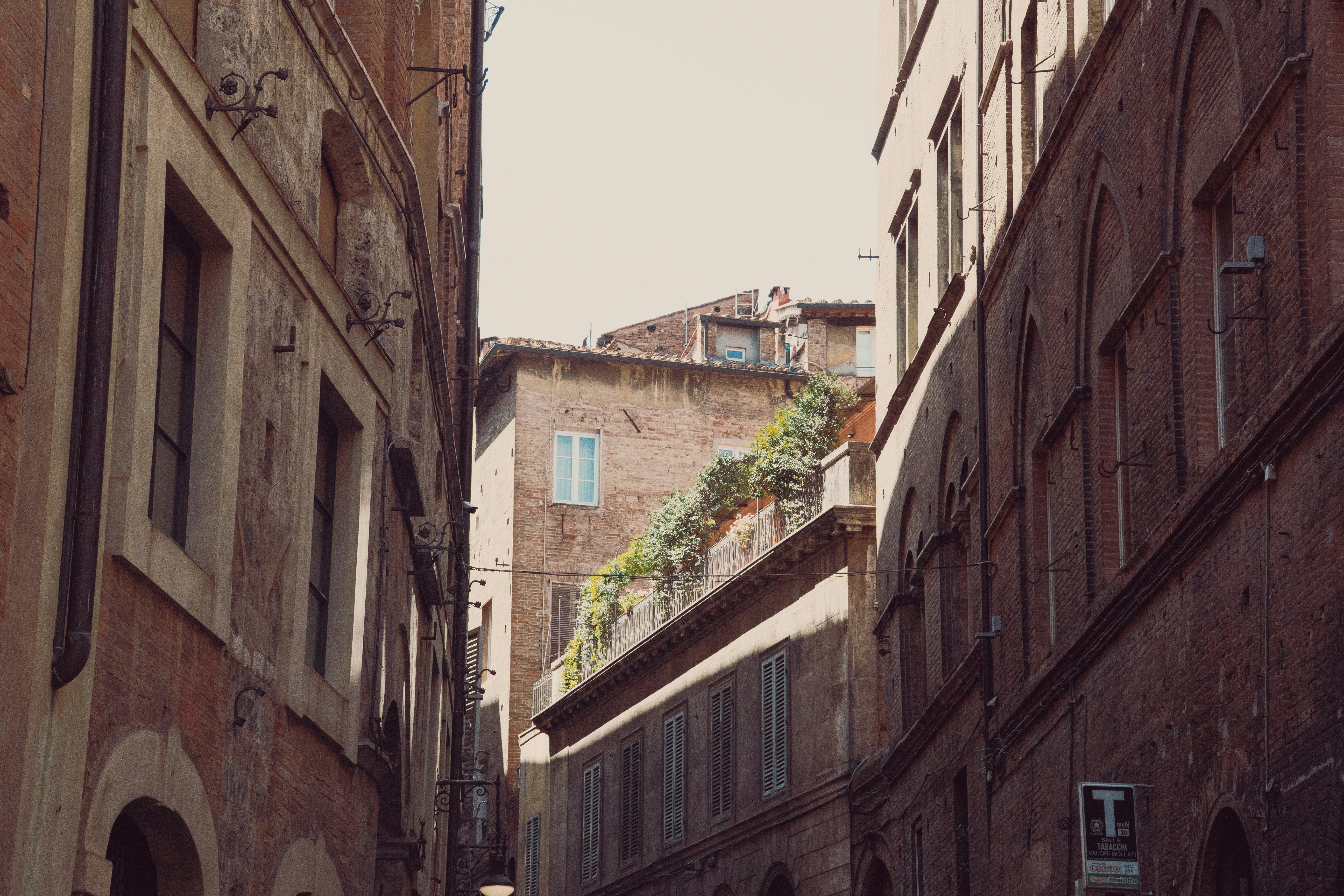A Narrow Venetian Alley Reaching for Light
