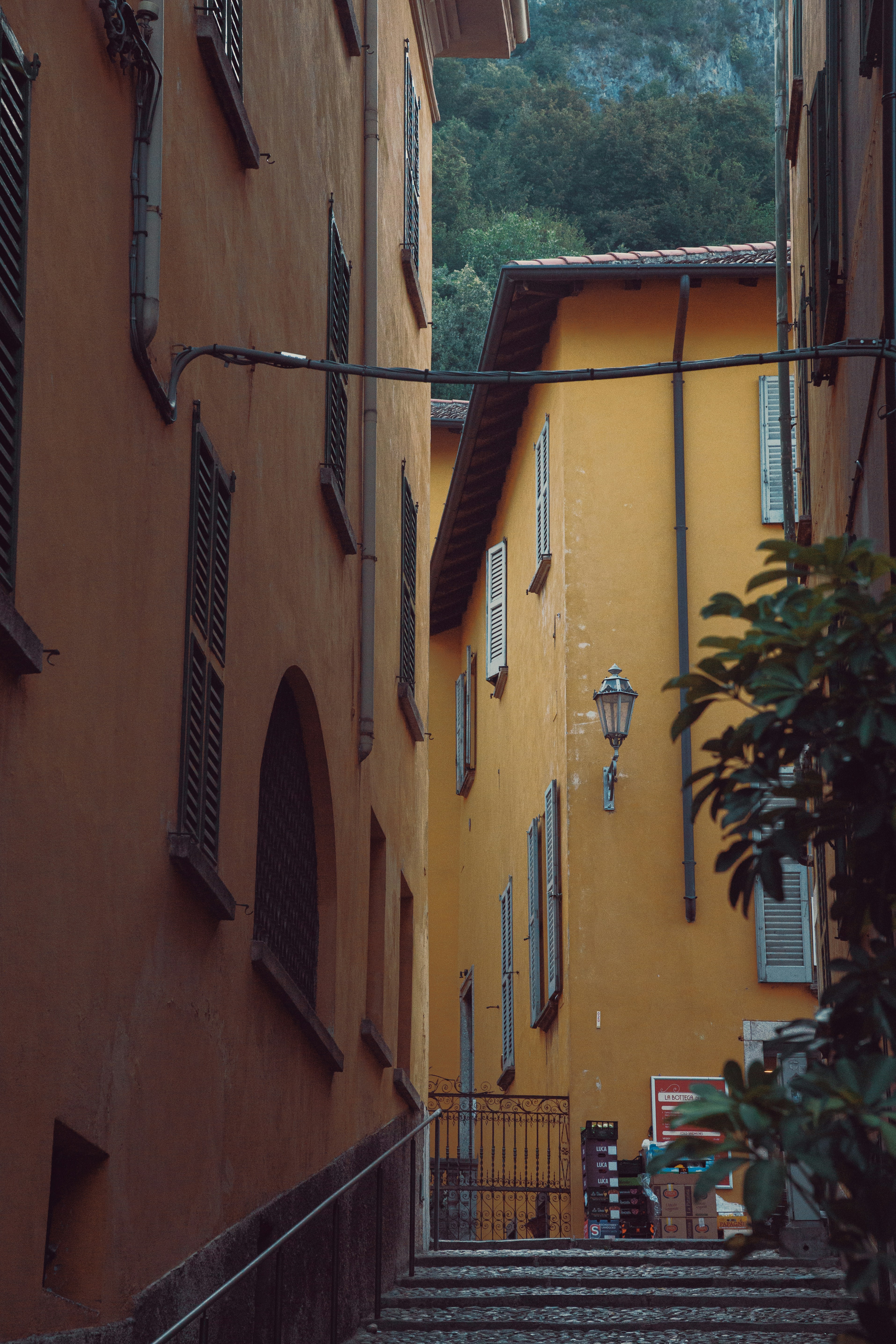 Sunlit Calle near a Yellow Facade