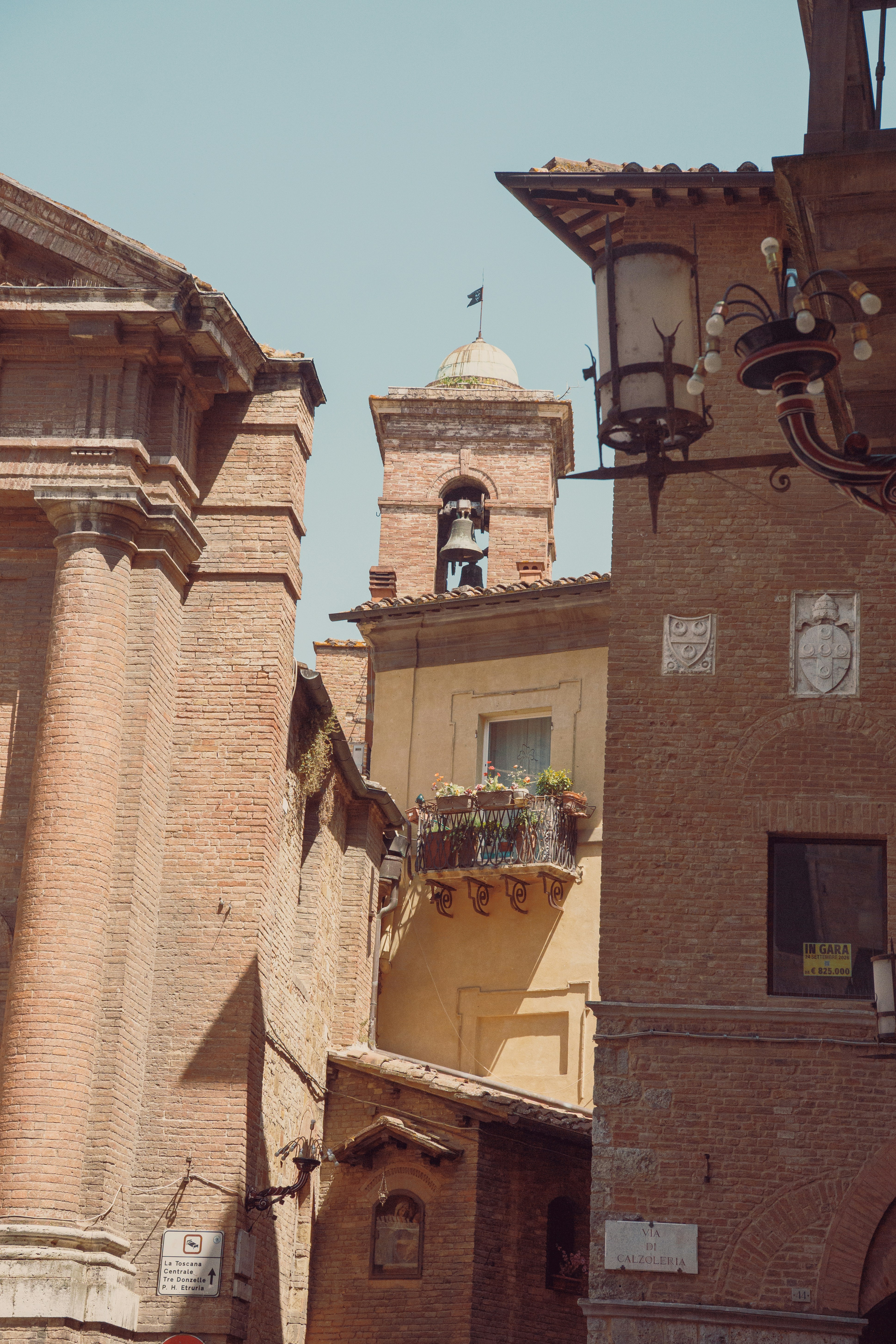 Bell Tower Overlook: Brick Facades and Sunlit Veranda