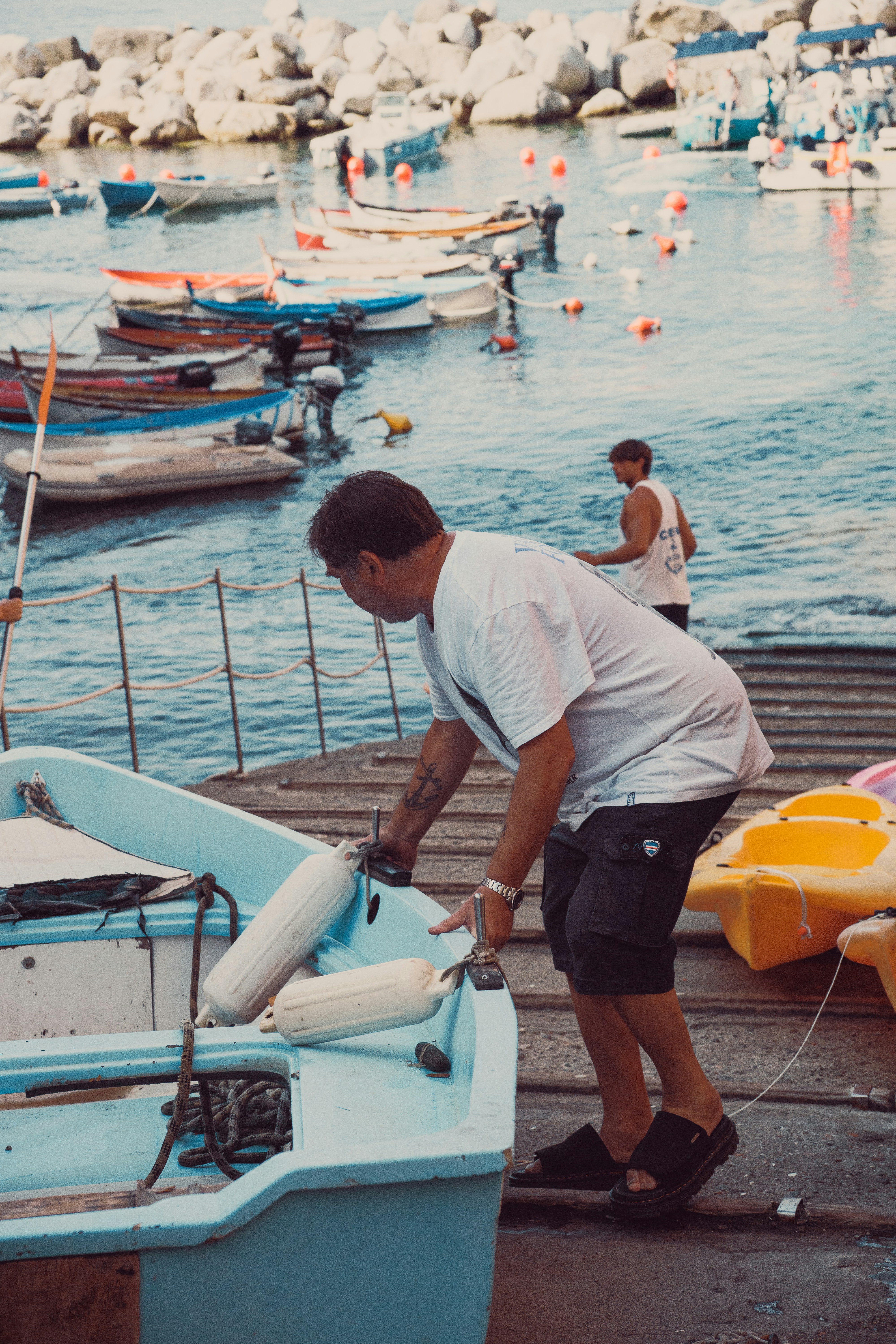 Harbor Hands: Preparing a Light Boat at Docks
