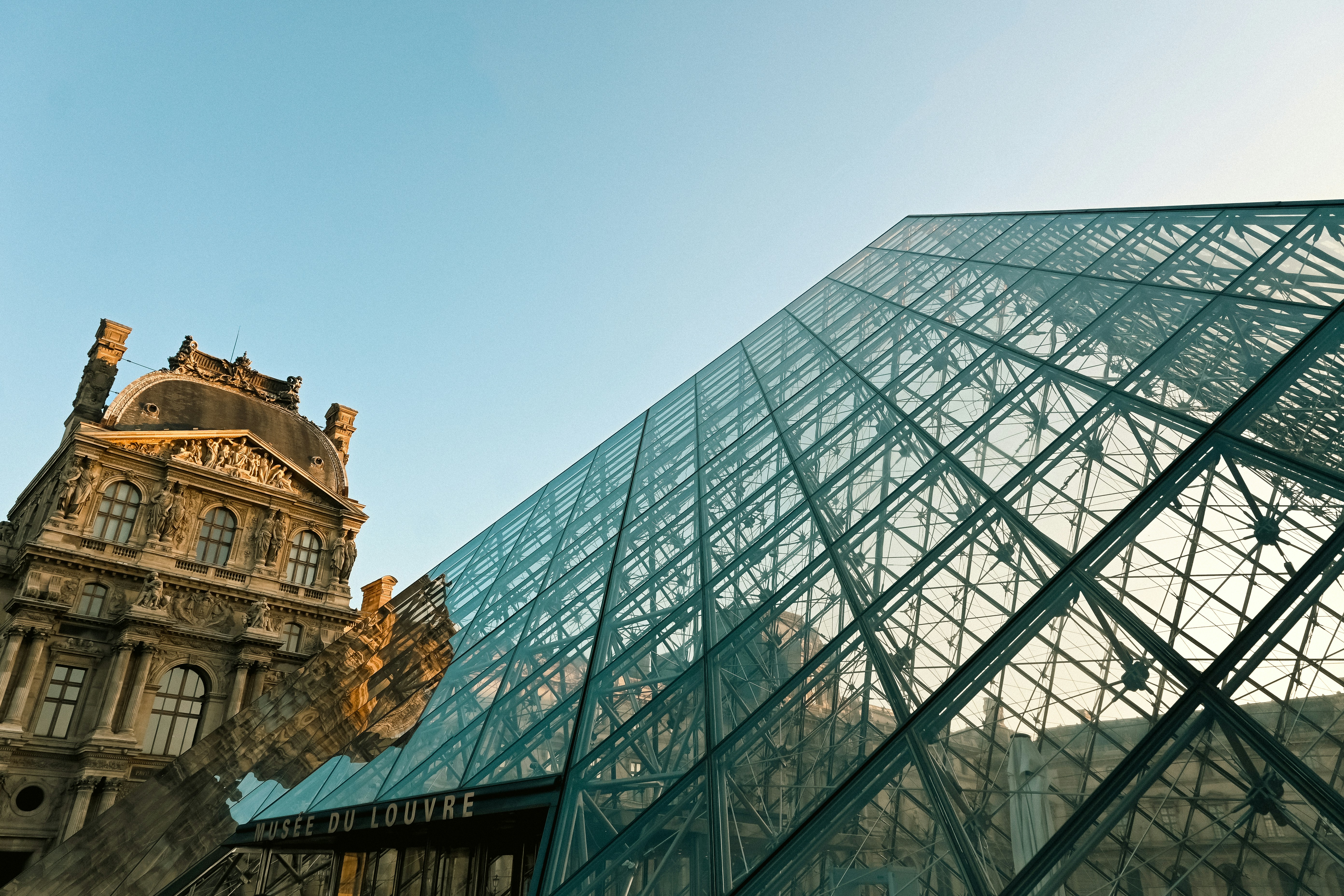 Glass and Stone Convergence: The Louvre Pyramid Reaching for the Sky