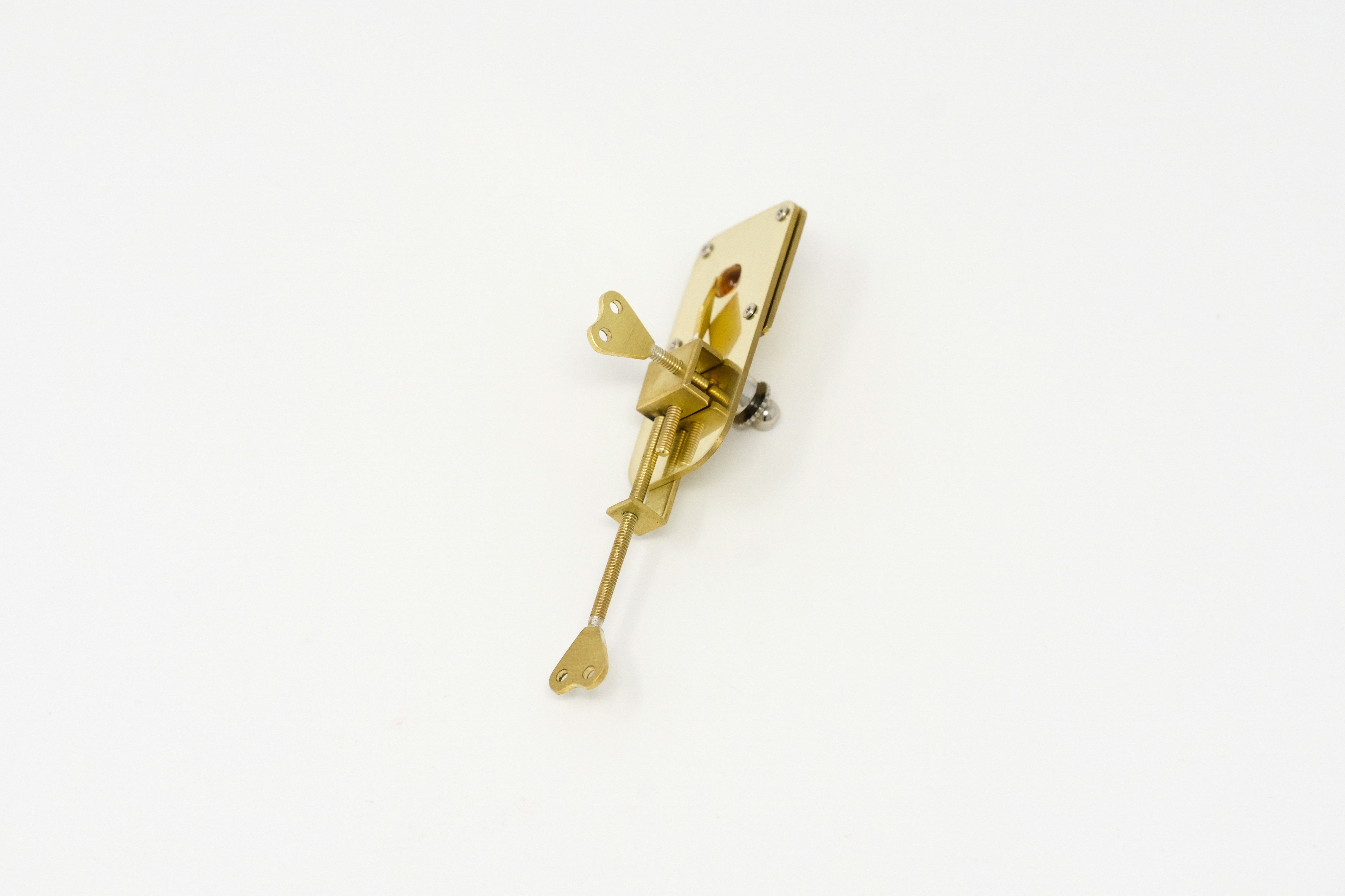 Minimalist Brass Mechanical Component in Plain White Studio
