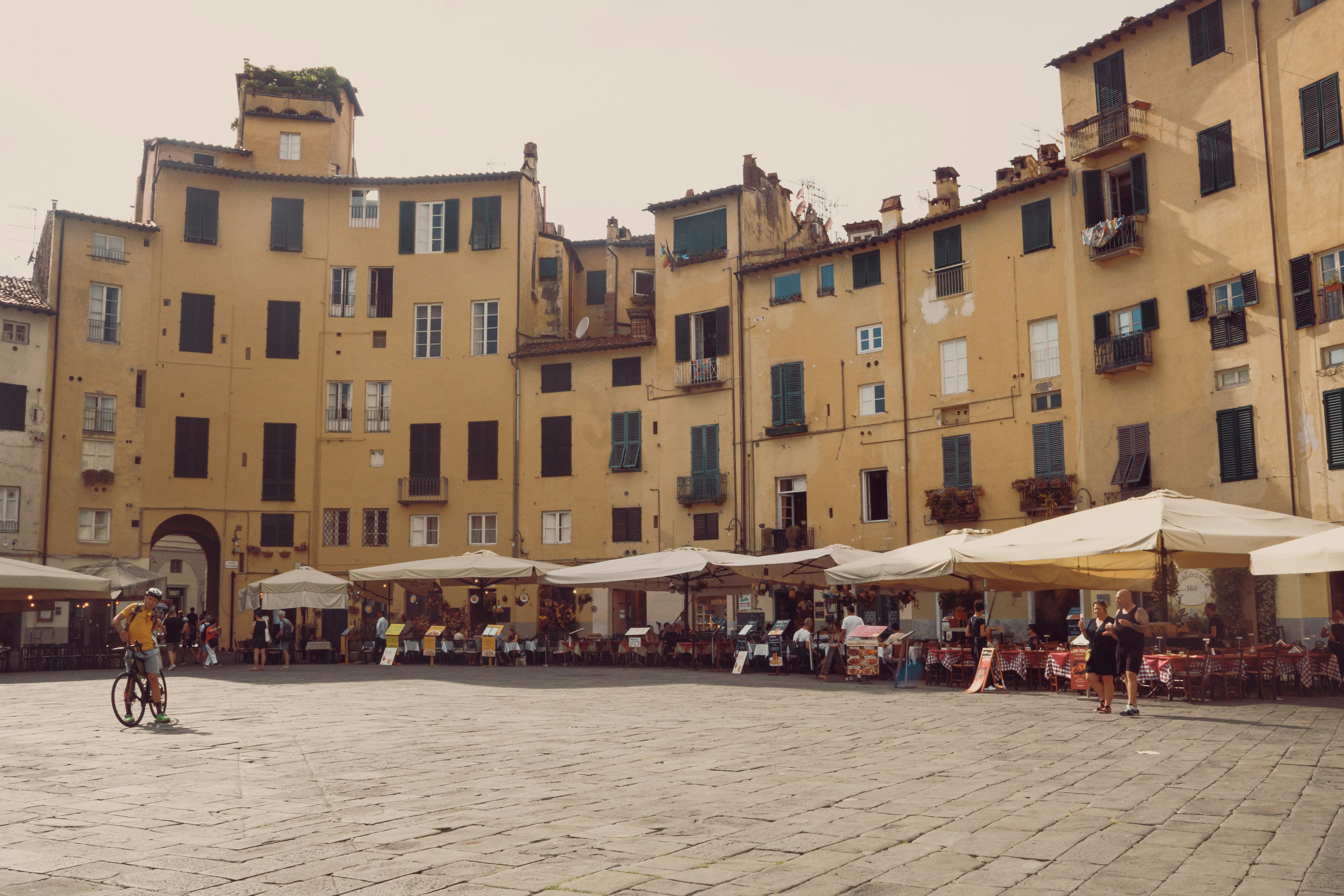 Cobbled Piazza Blankets and Sunlit Atelier Facades