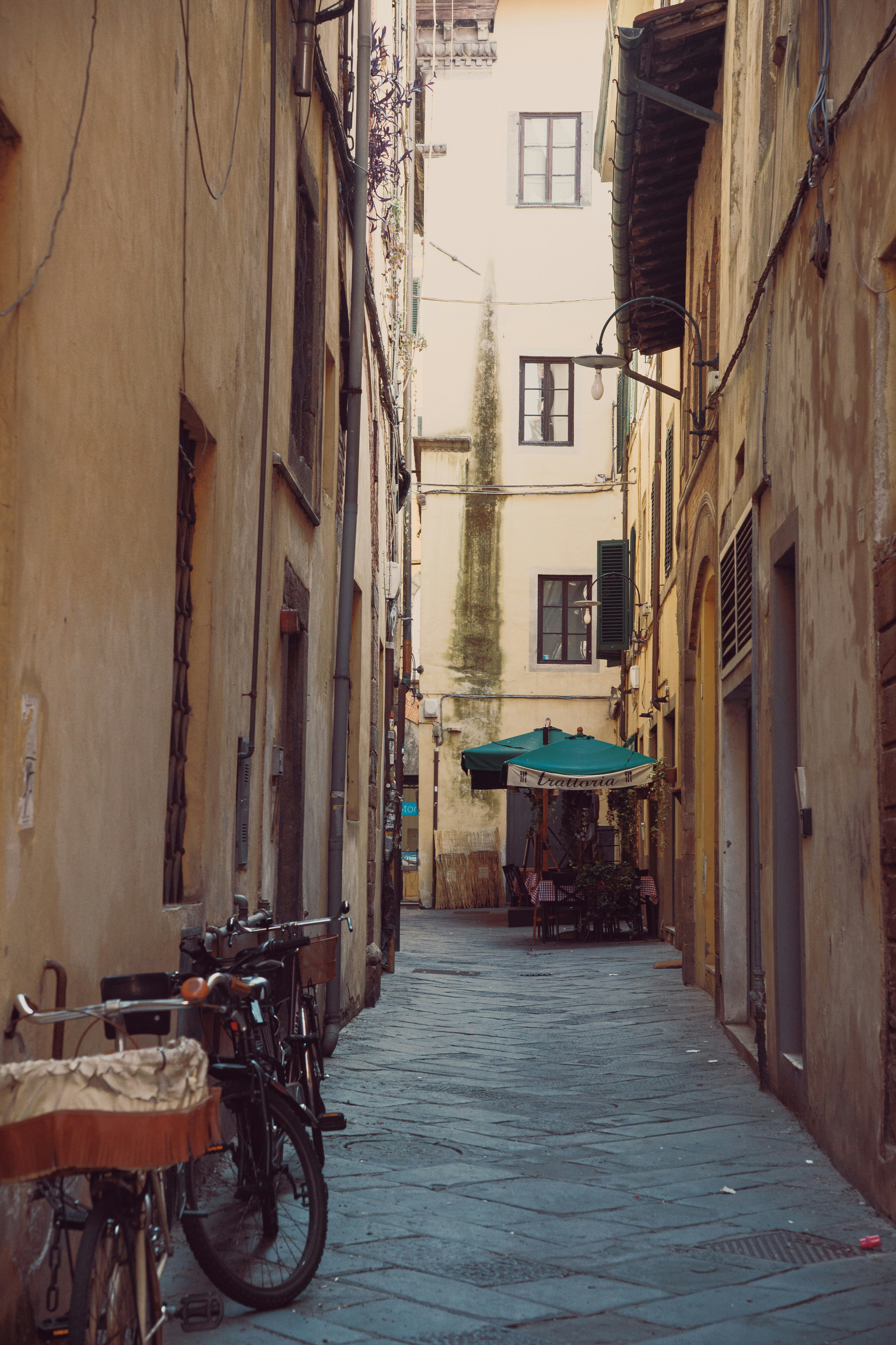 Mellow Alley: Sunlit Passage Between Old Walls