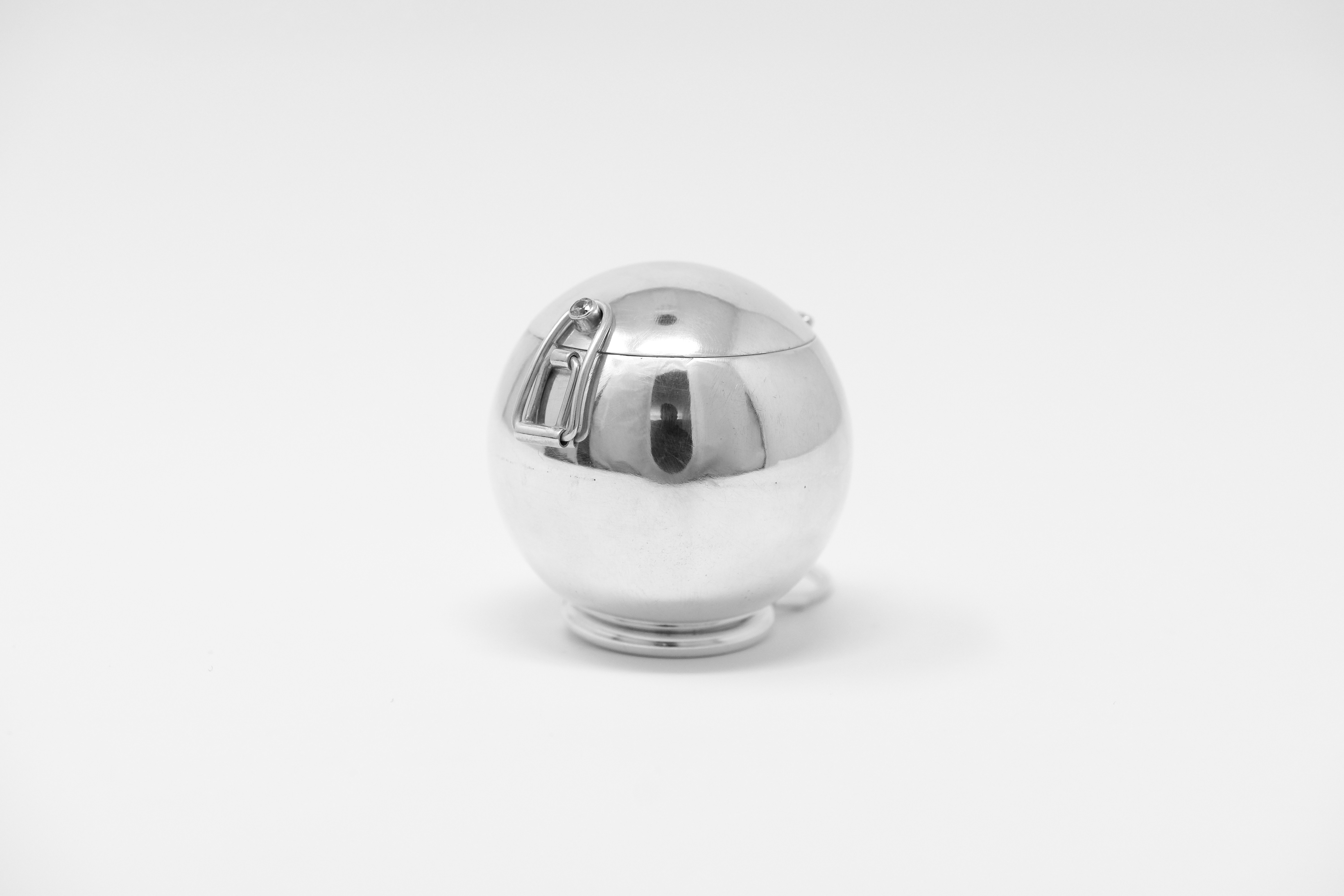 Polished Sphere on a Quiet White Stage