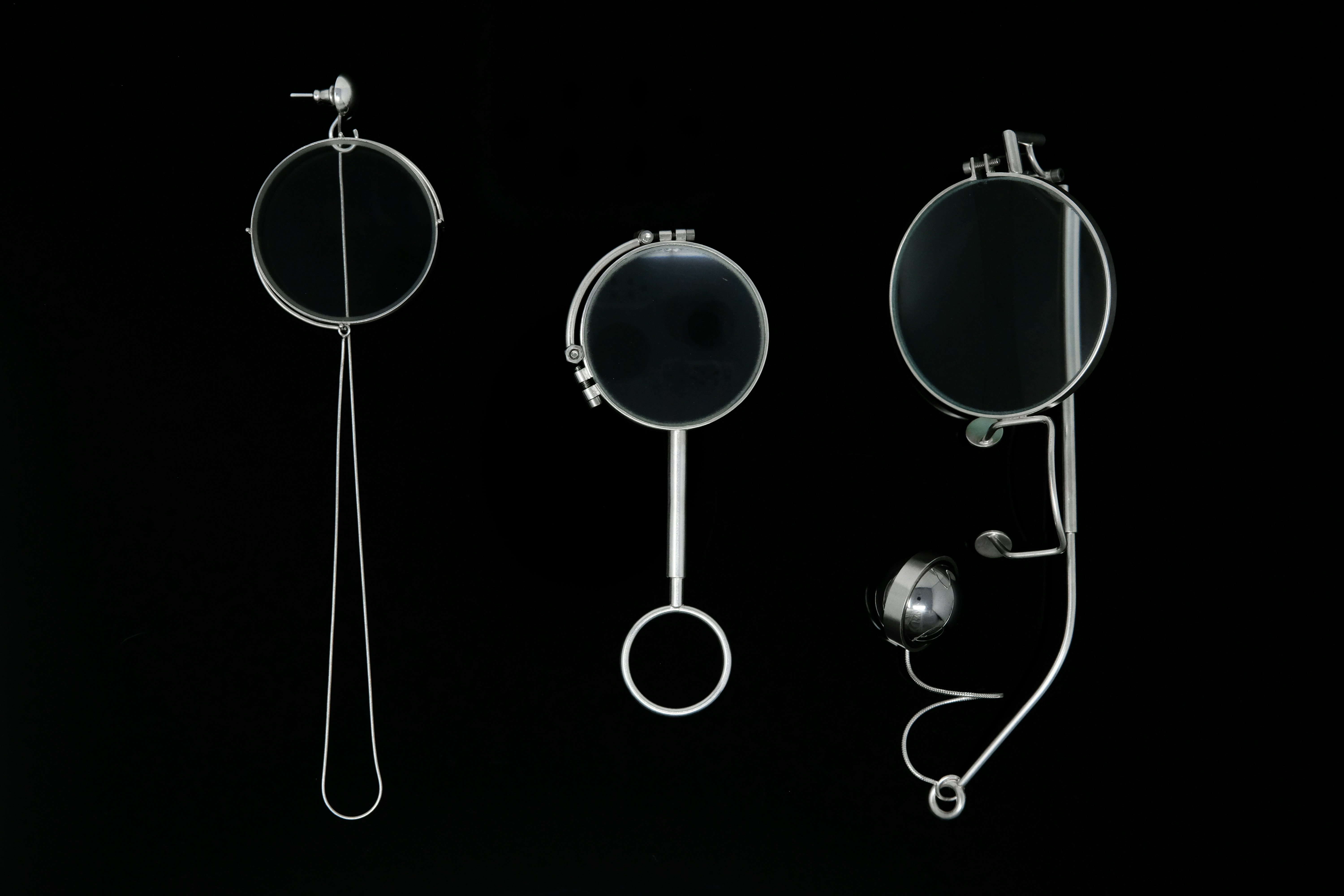 Three Precision Mirrors in a Dark Studio