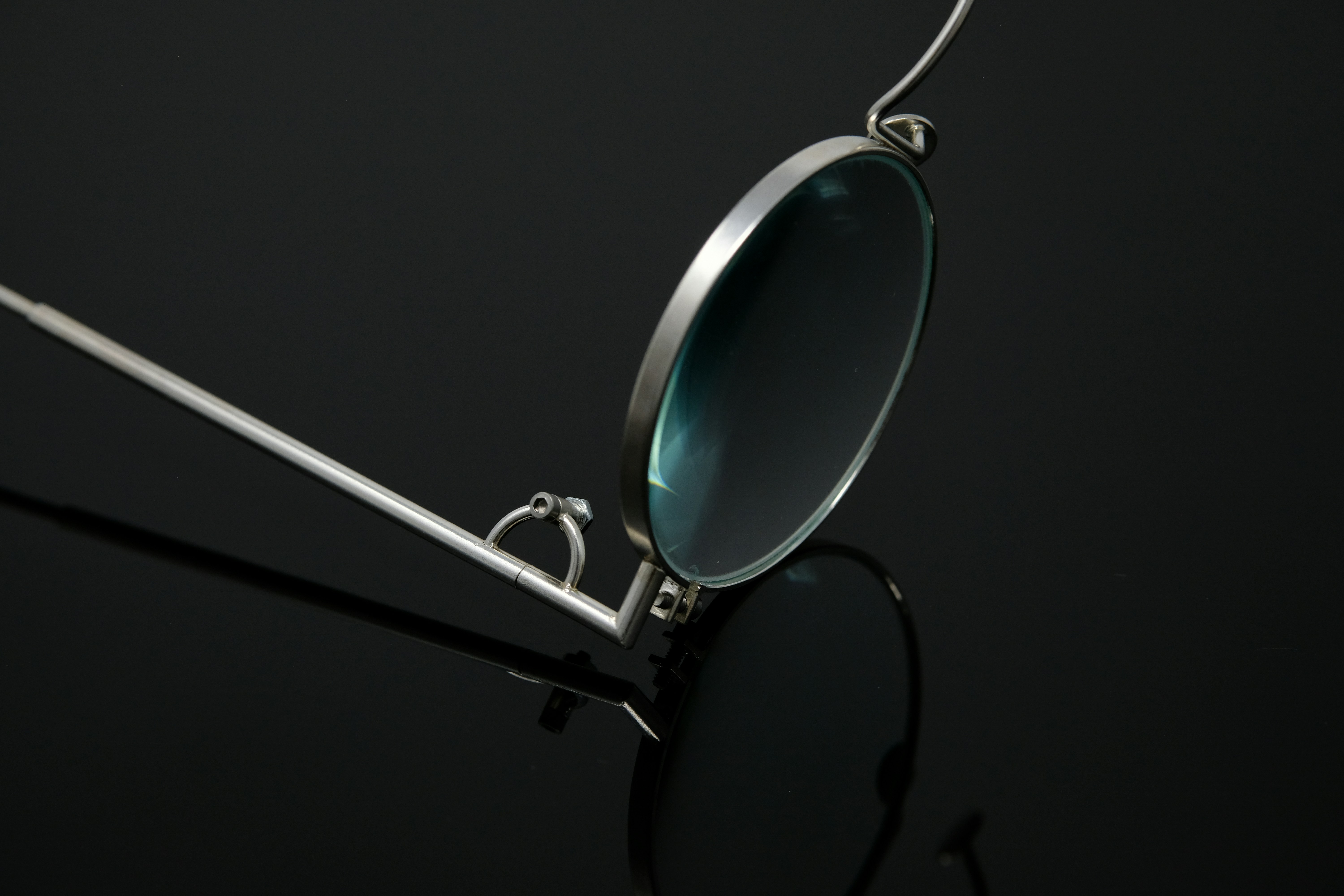Minimalist Glass: Precision Aperture in a Black Studio