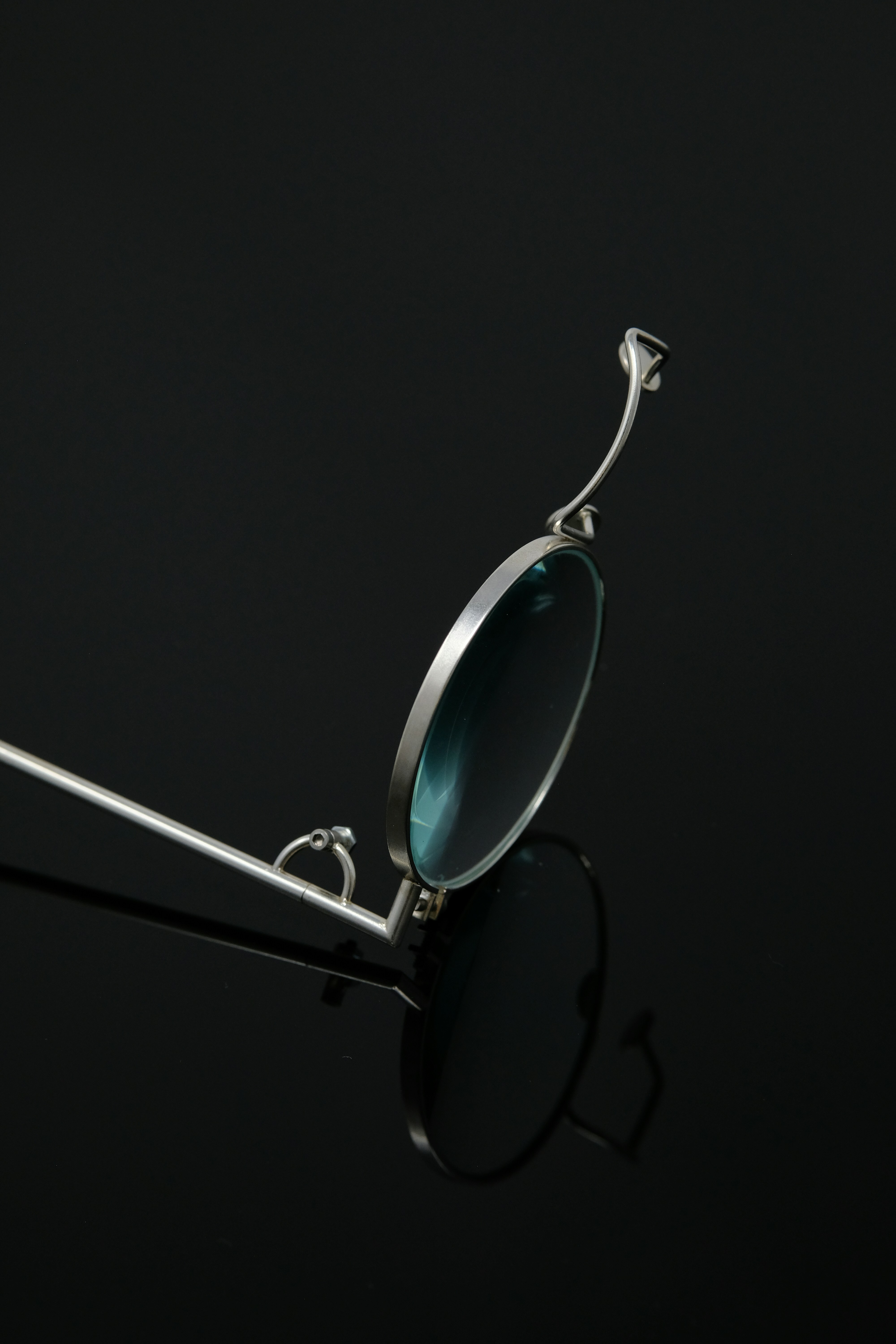 Metallic Lens: A Minimalist Still Life with Round Frame