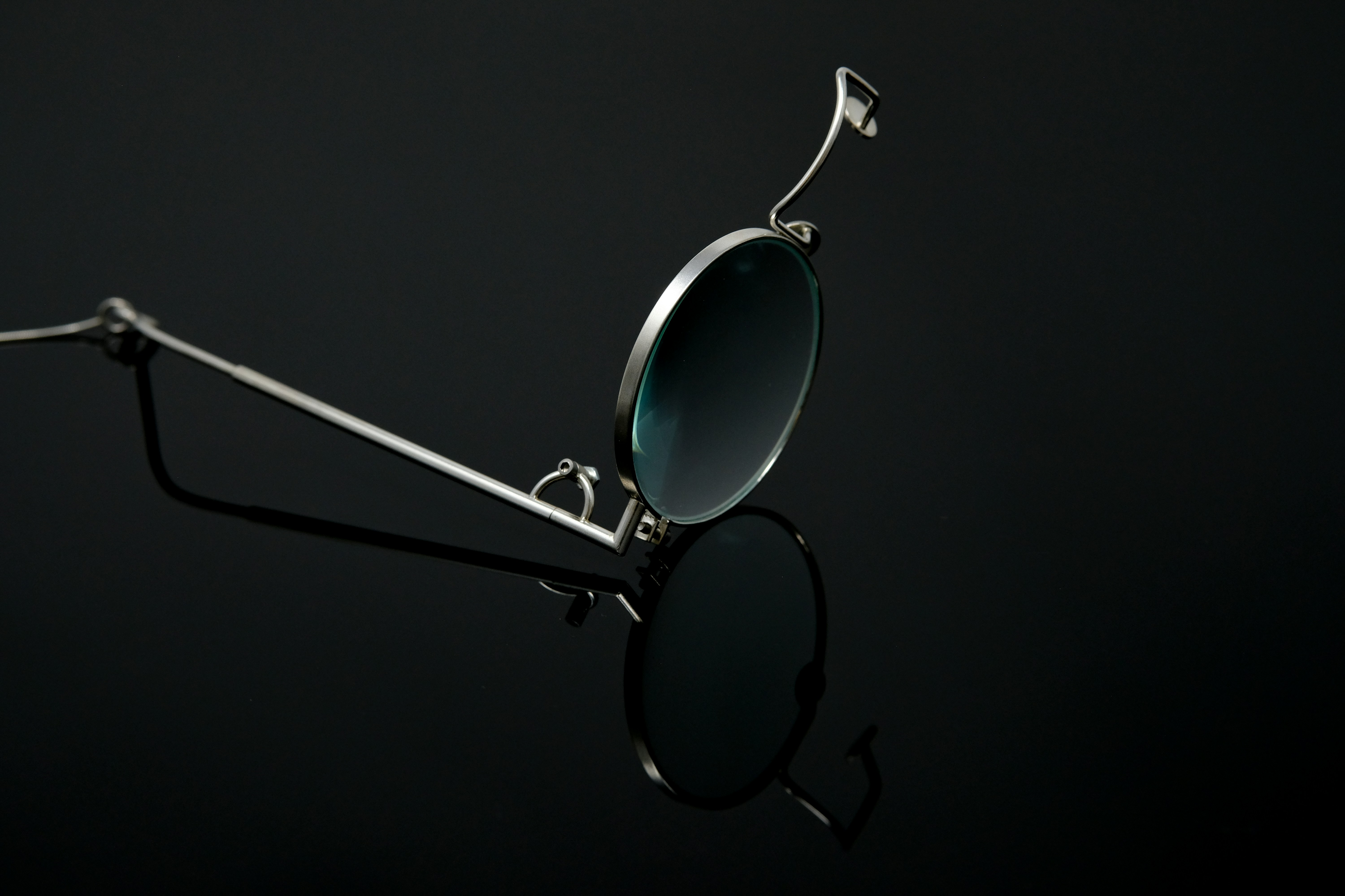 Reflections in a Fold: Minimalist Glasses on a Velvet Night