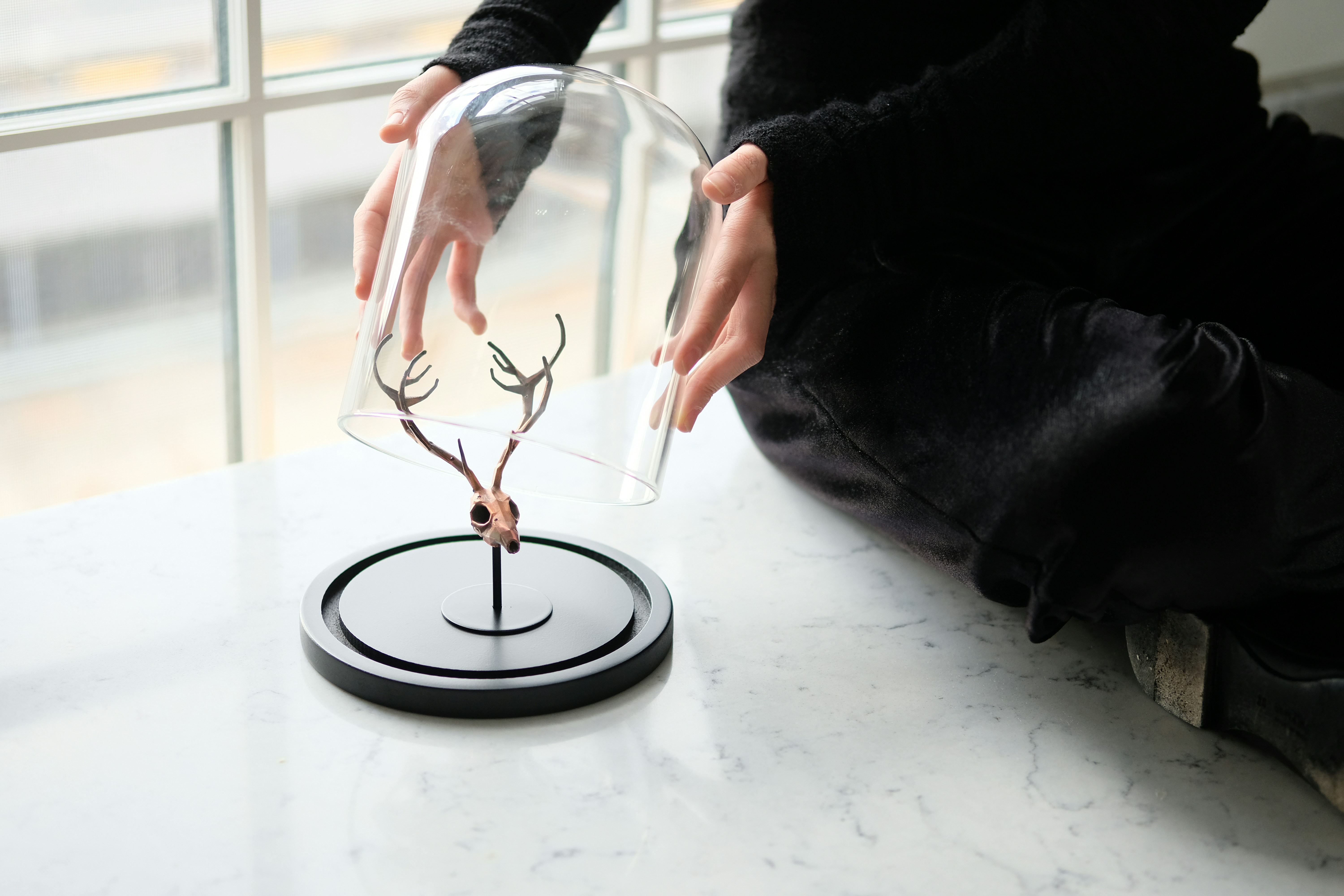 Glass Dome Reveal: A Delicate Deer Figurine Under Glass