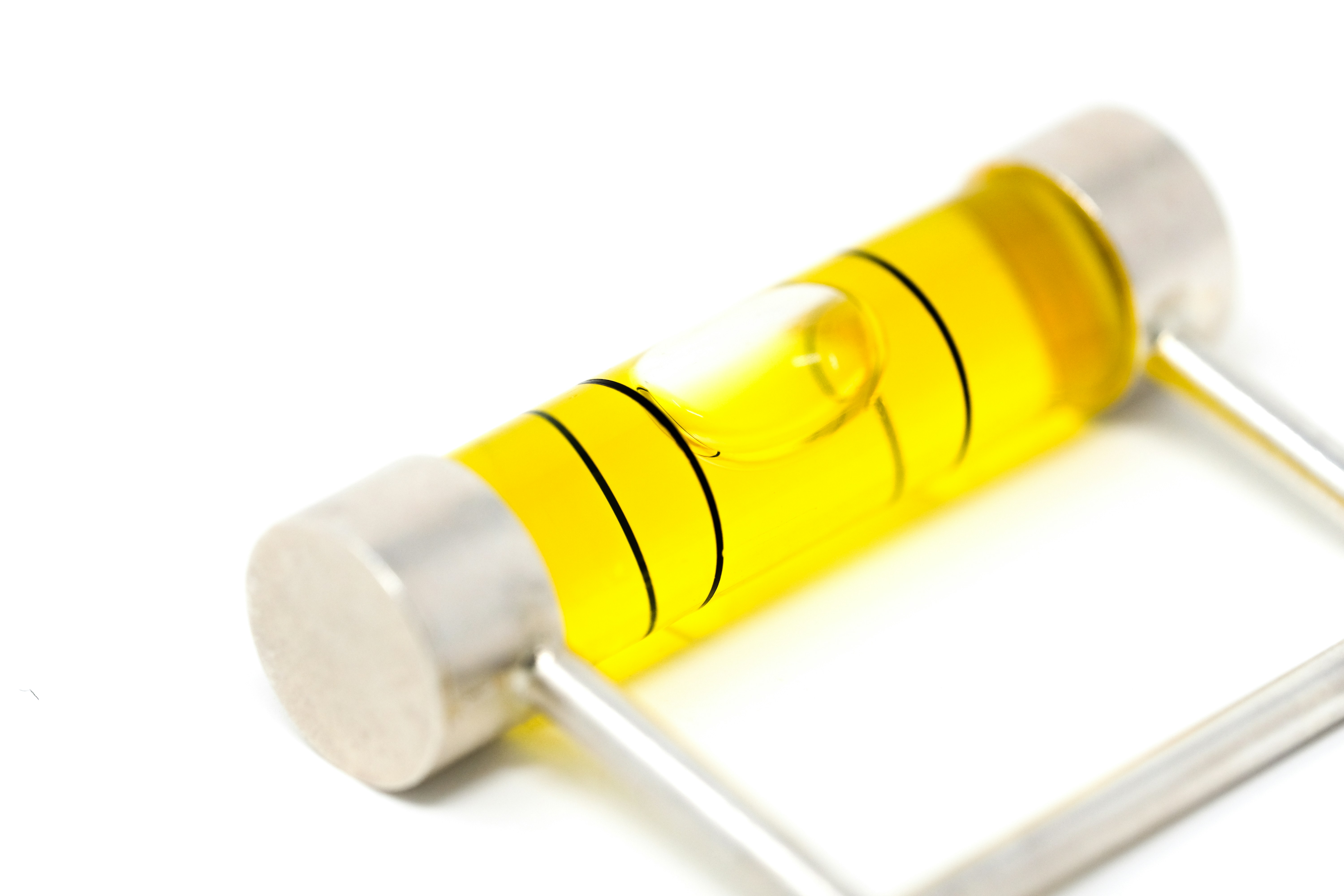 Liquid in a Slide: A Titanium-Capped Microscale Spirit Level