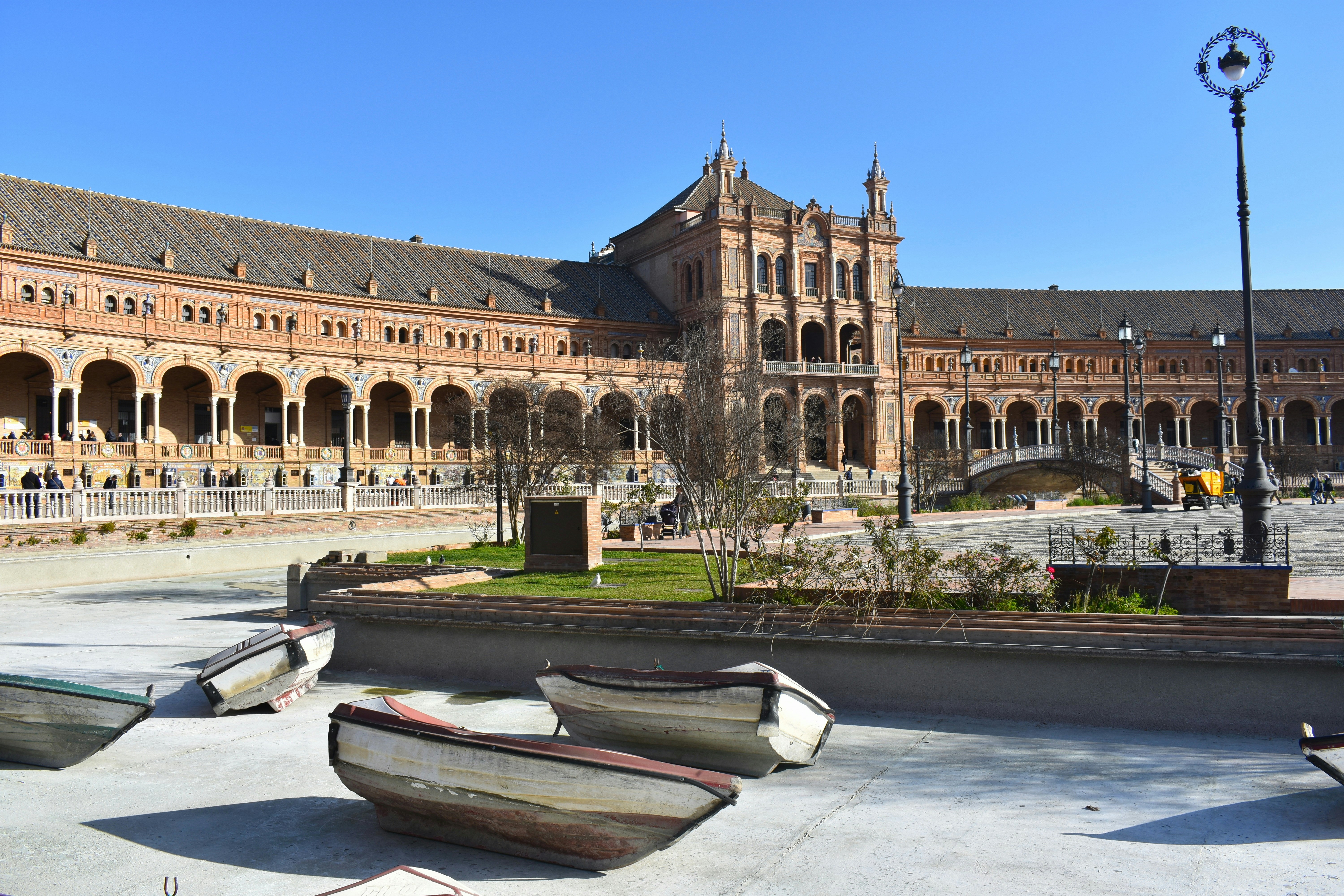 Arched Courtyard of the Plaza Mayor: Boats, Steps, and Stone Facade