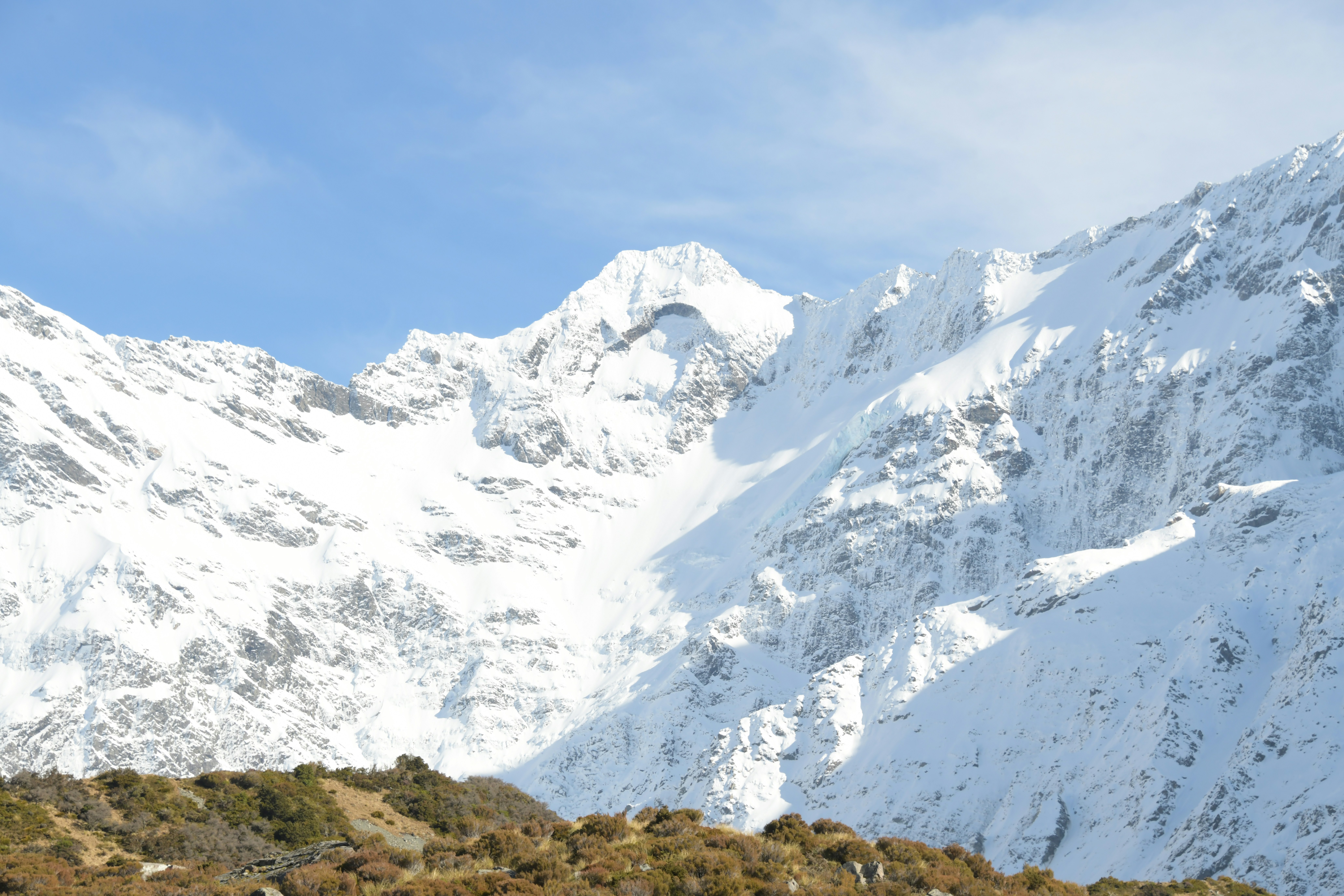 Snowbound Crest: A Quiet Ascent Beneath Bluer Than Blue Skies